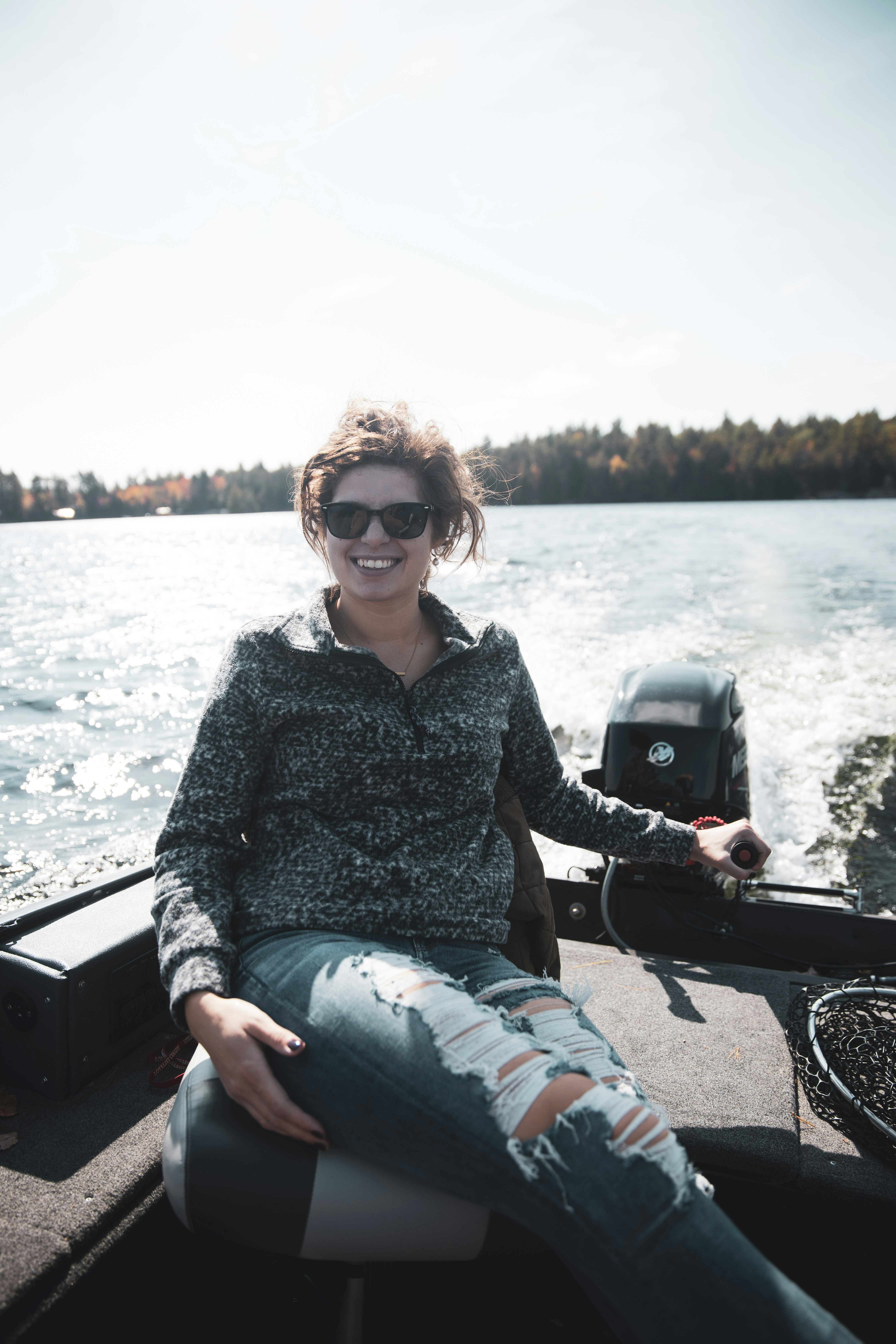 Smiles and Motorized Waves: A Sunny Boat Moment
