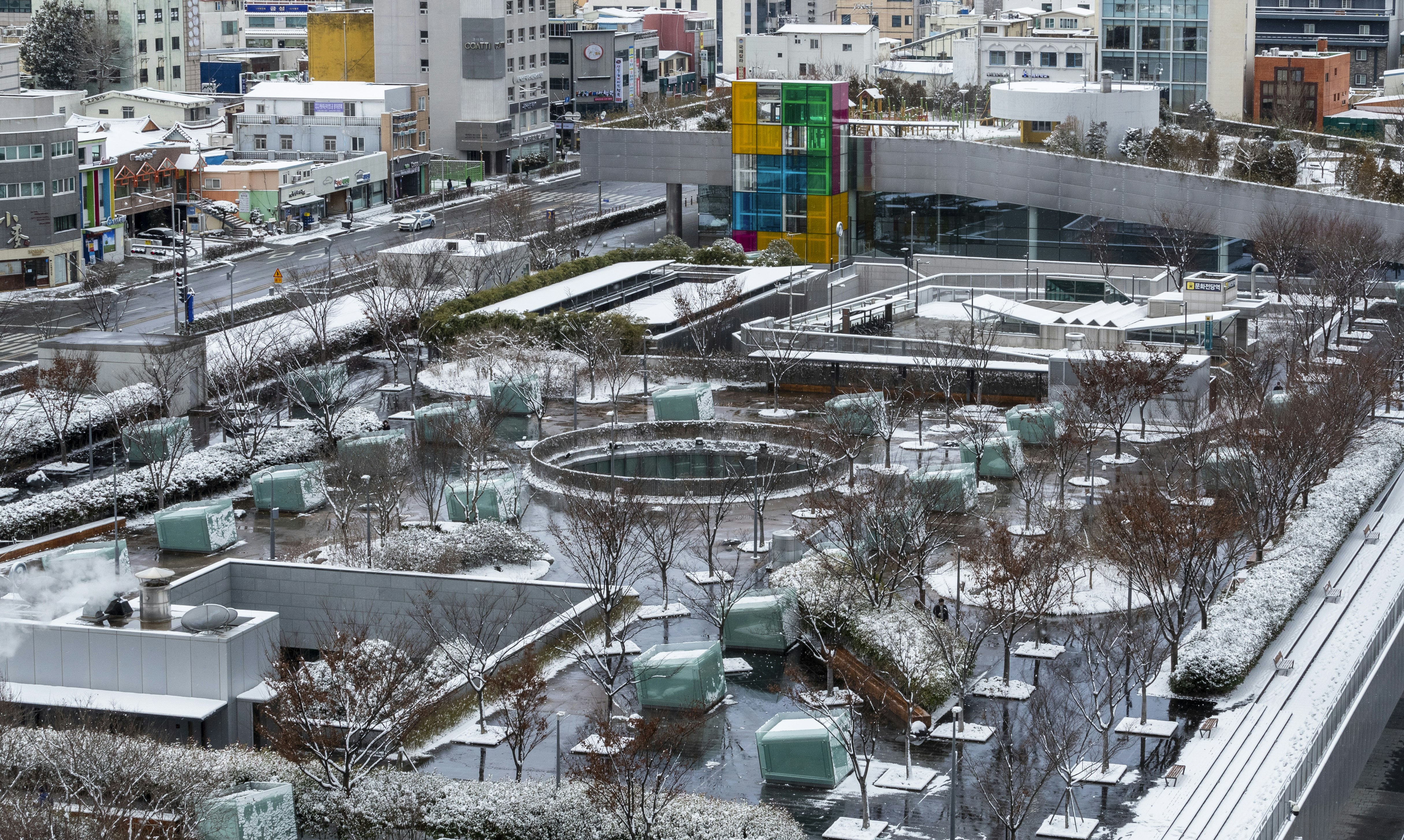 Circular Heart of a Snow-Blanketed City Rooftop Garden