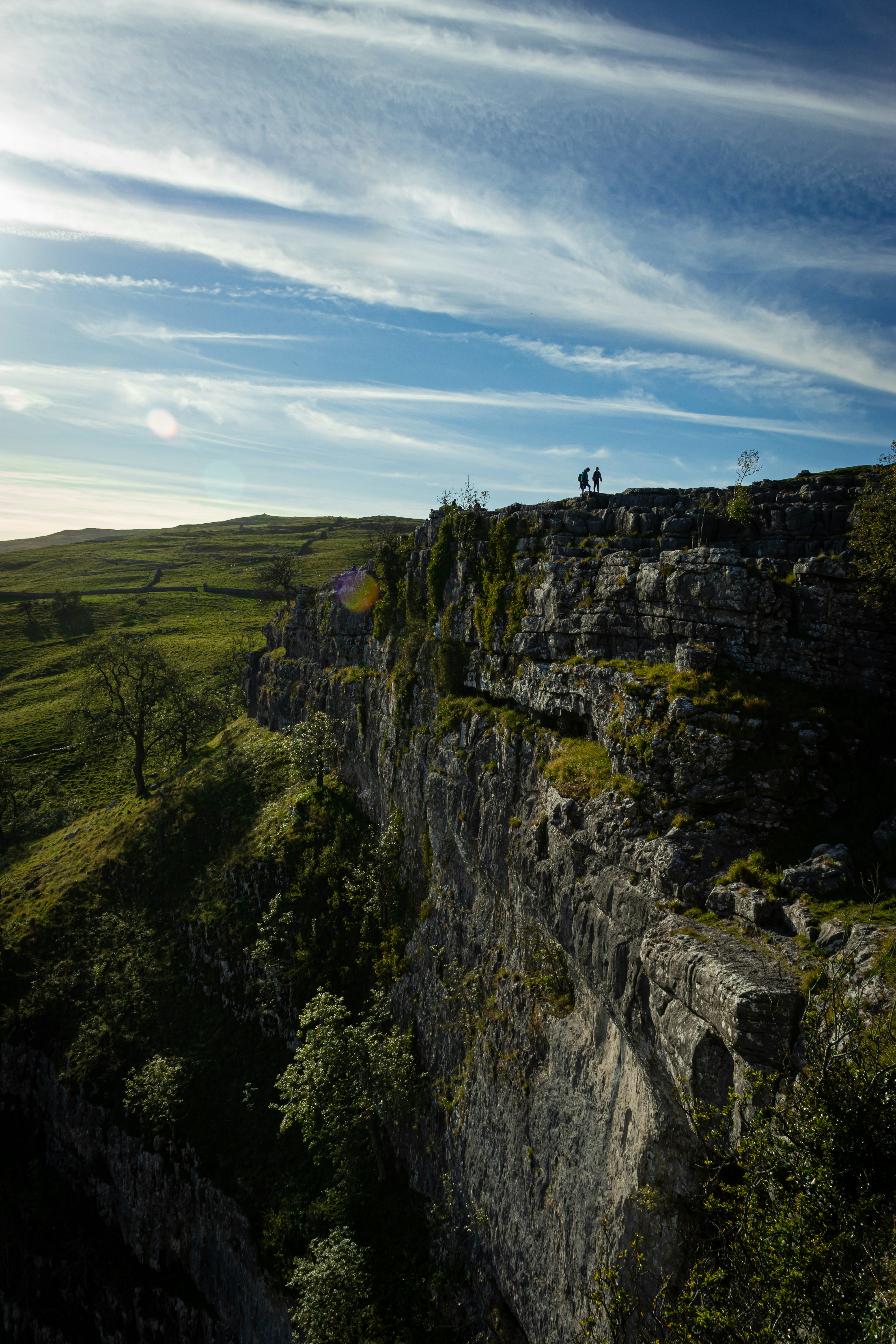 Edge of the World: Two Climbers on a Weathered Bluff
