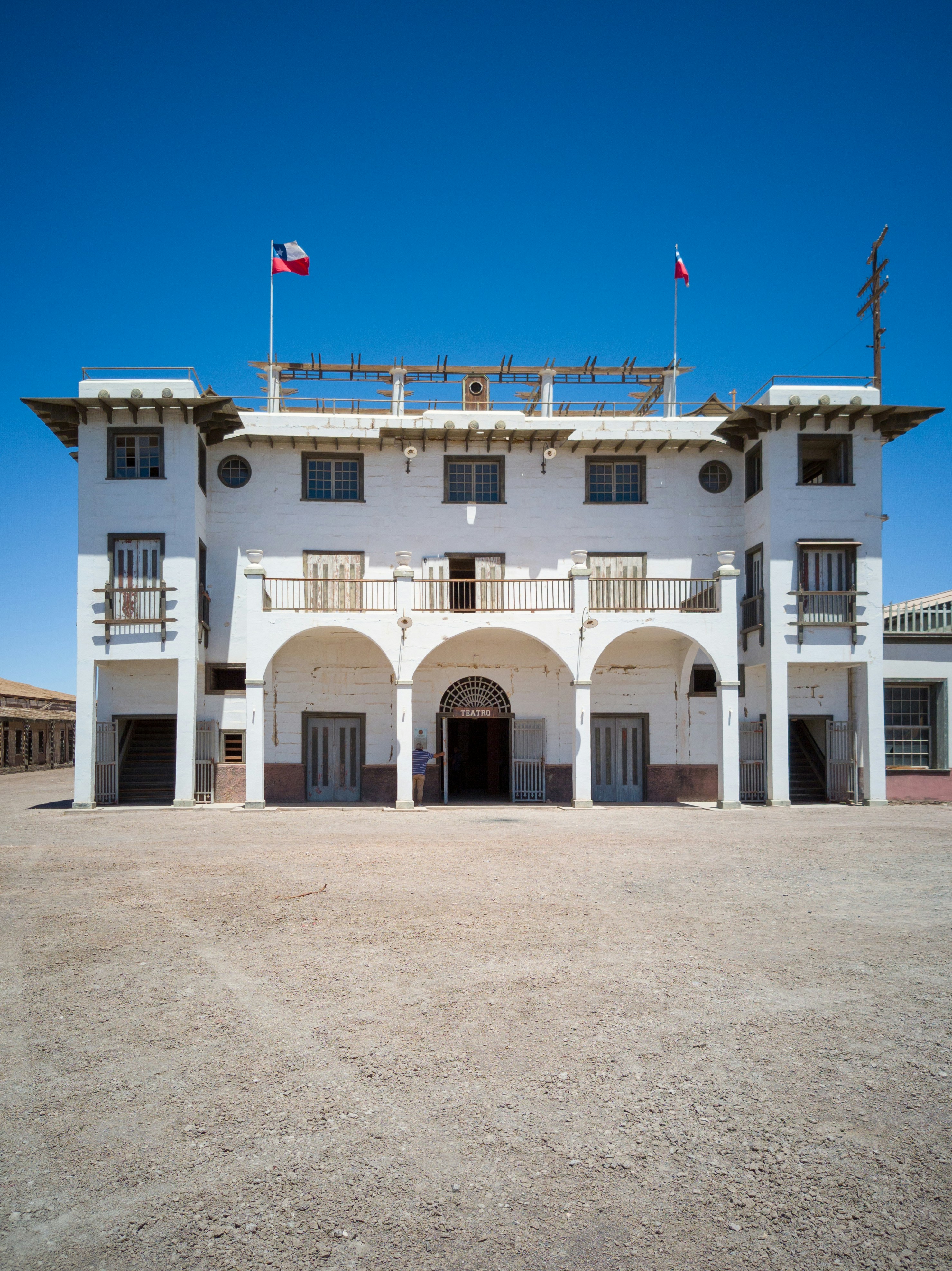 Symmetry Under the Blue Sky: The White Archway Hall