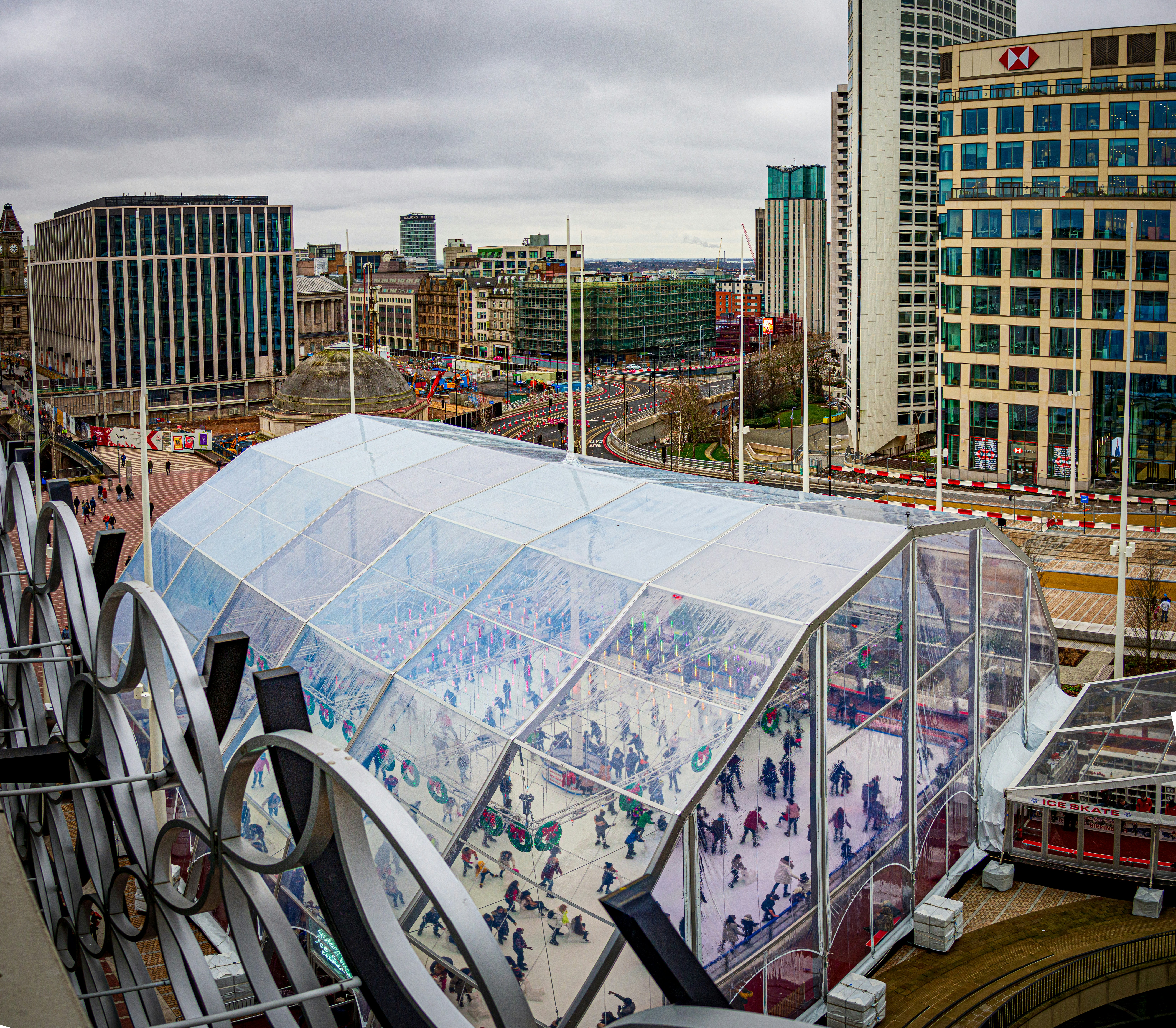 Crystal Canopy Over the City: A Busy Glass Atrium Looms Above Tracks