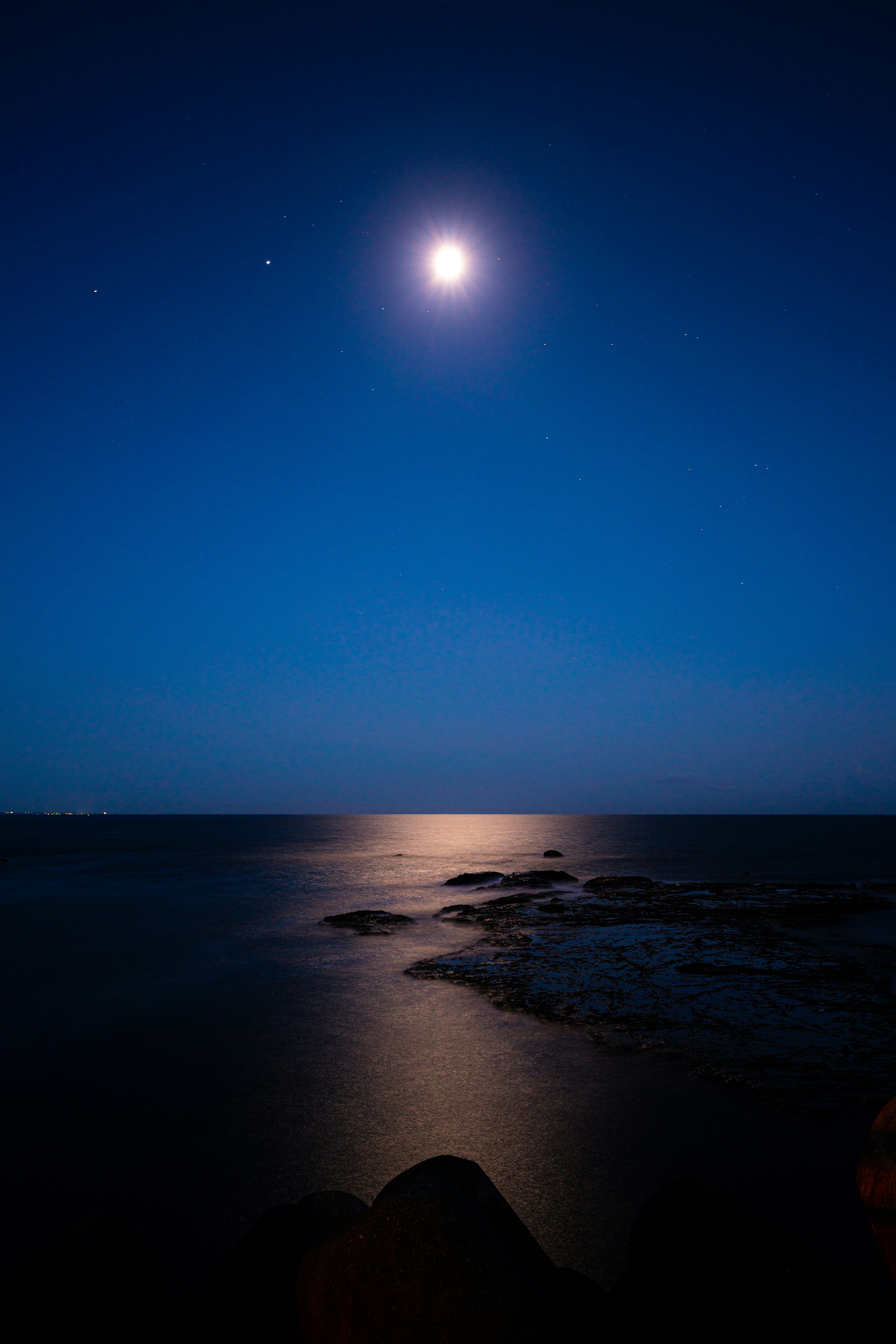Moonlit Reflections: A Silver Trail Across the Quiet Sea