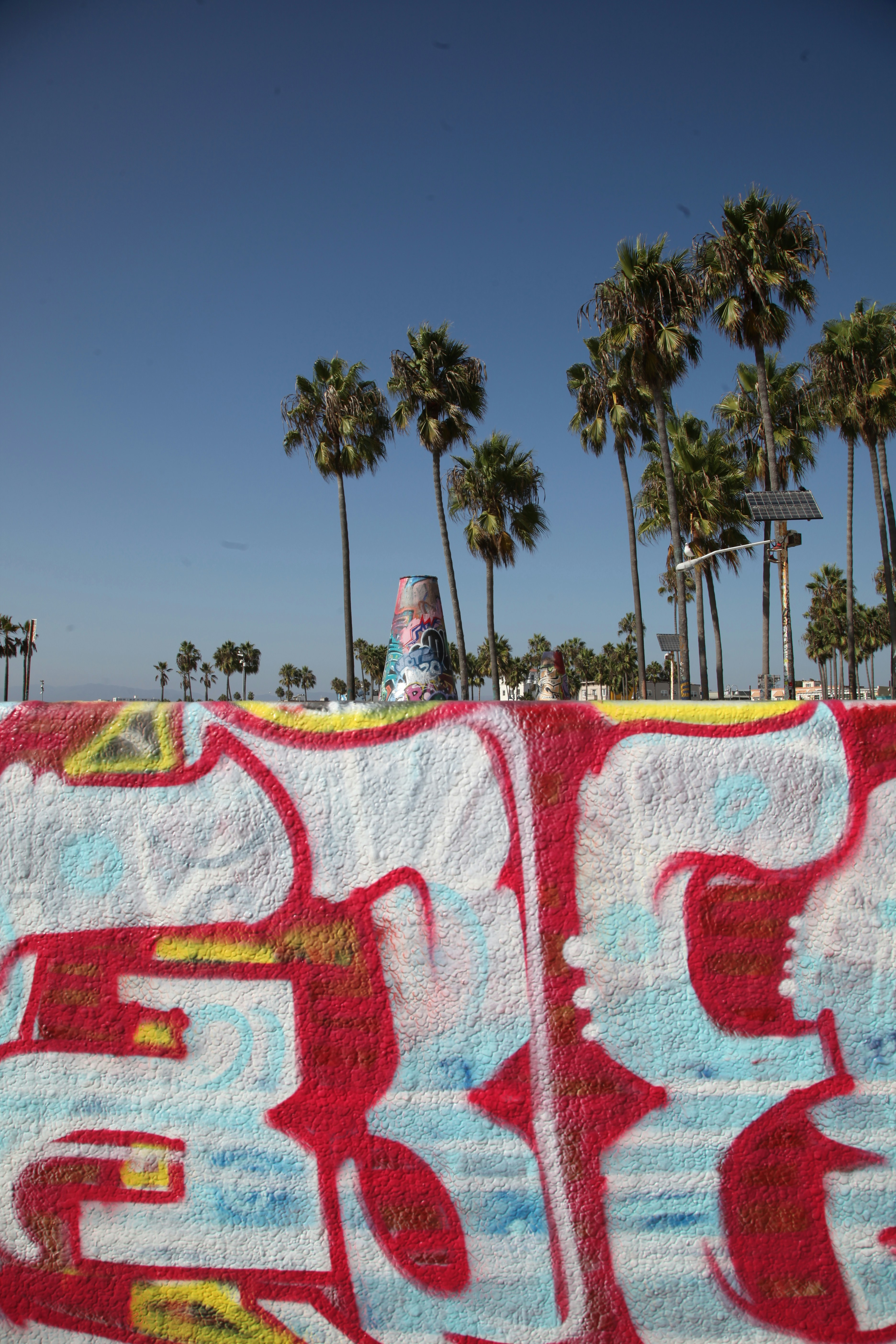 red white and blue graffiti on wall