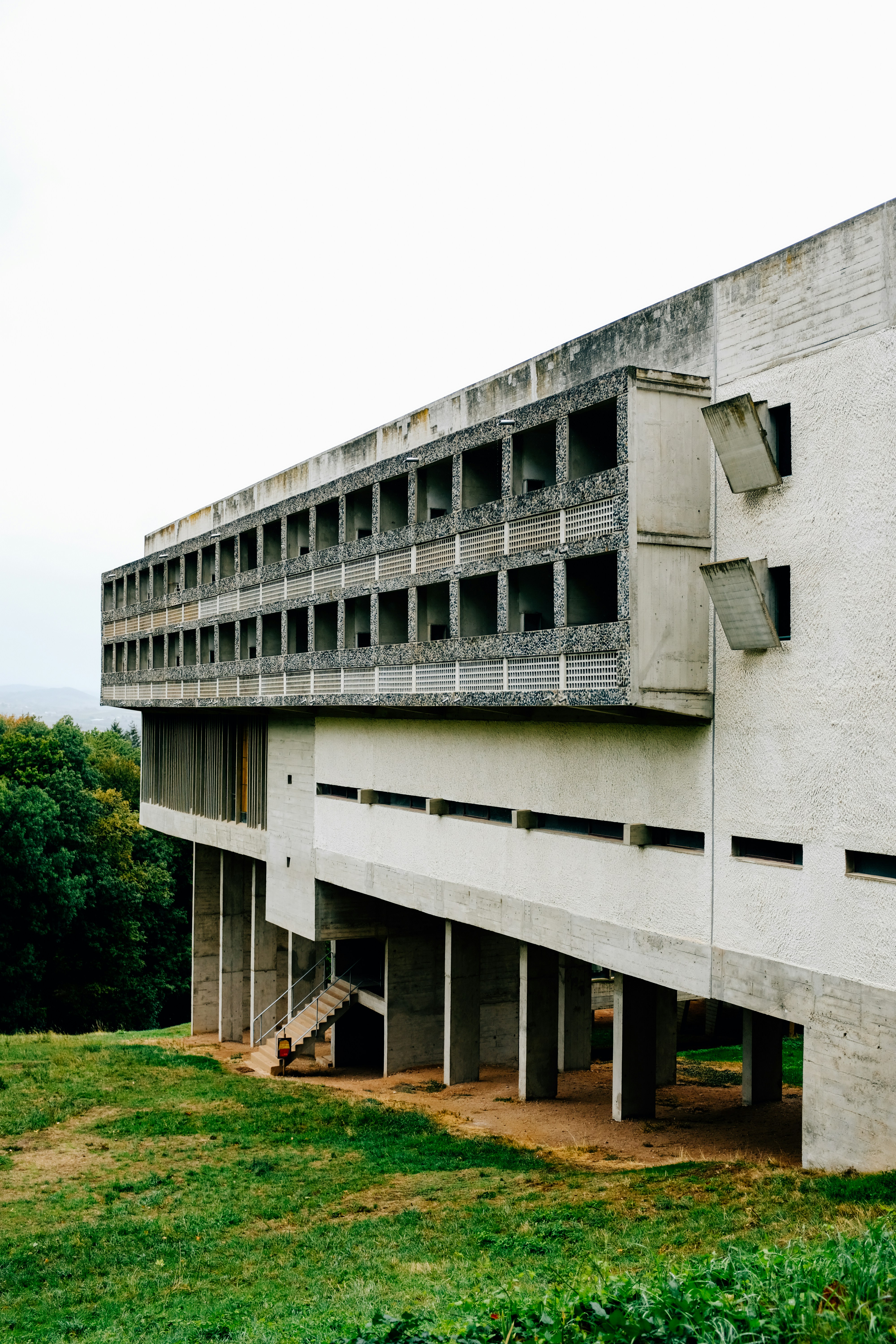white concrete building near green grass field during daytime