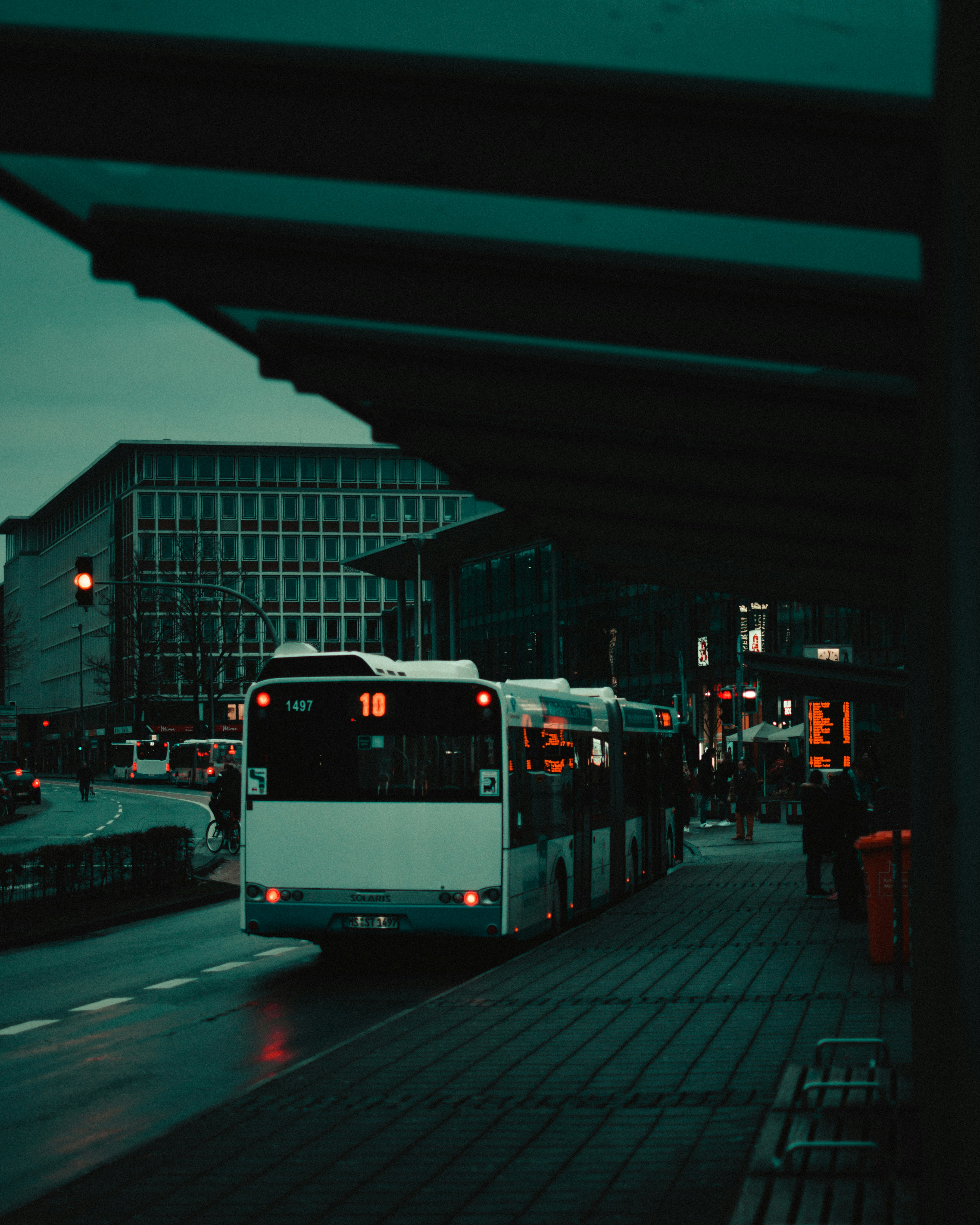 white and red tram on road during night time