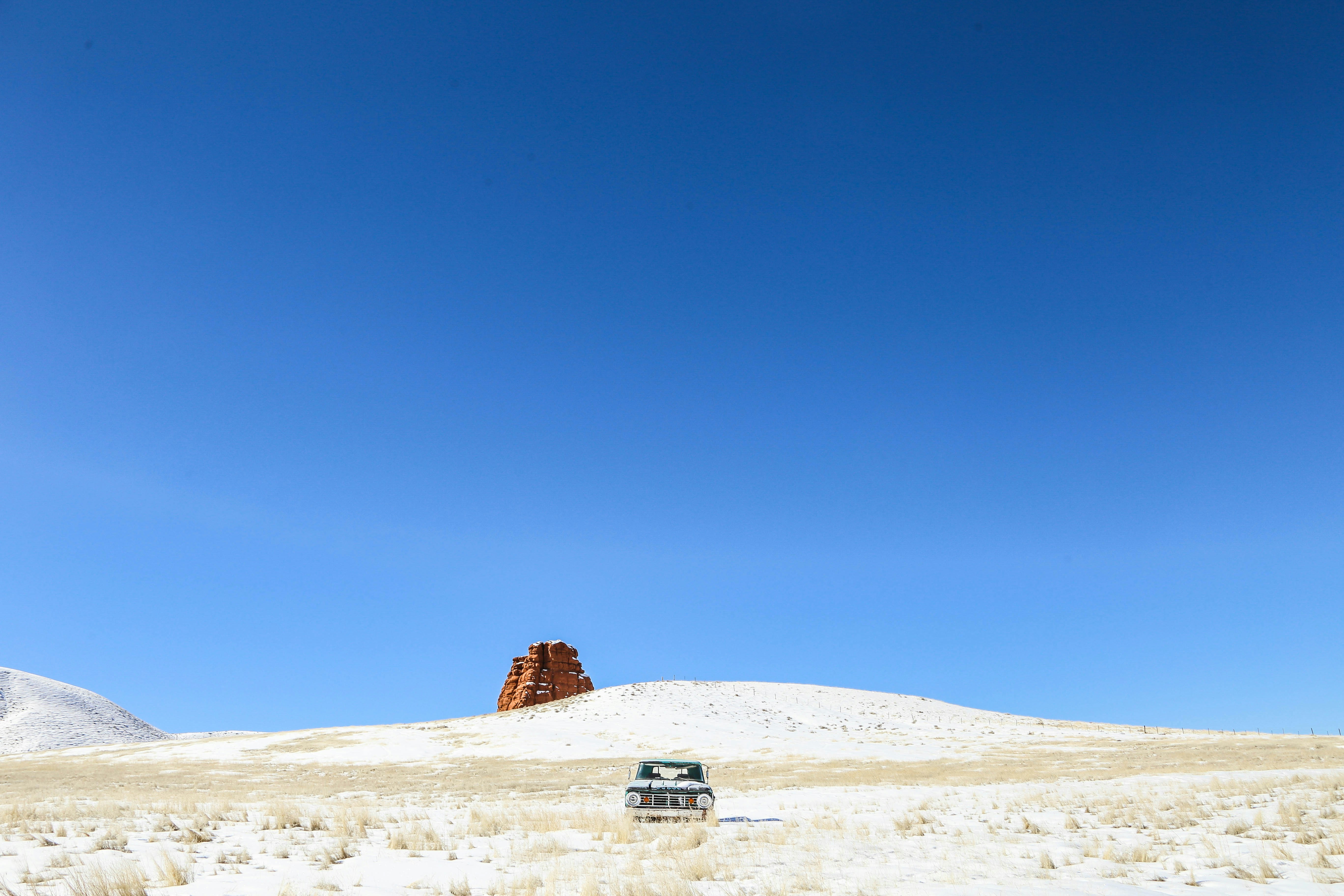 Abandoned truck in the middle of a Wyoming field.