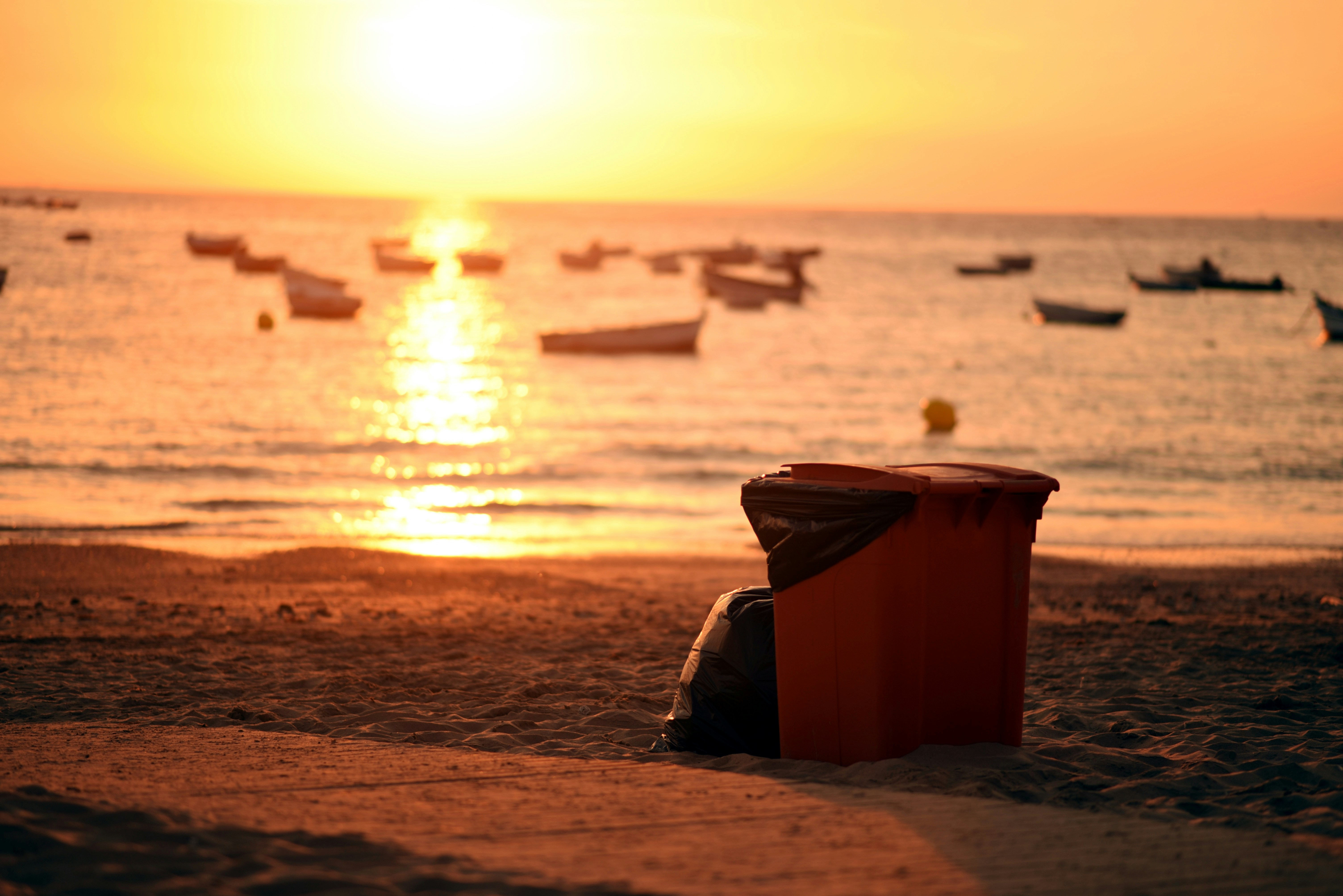 Brown plastic bucket on beach shore during sunset photo – Free Outdoors ...