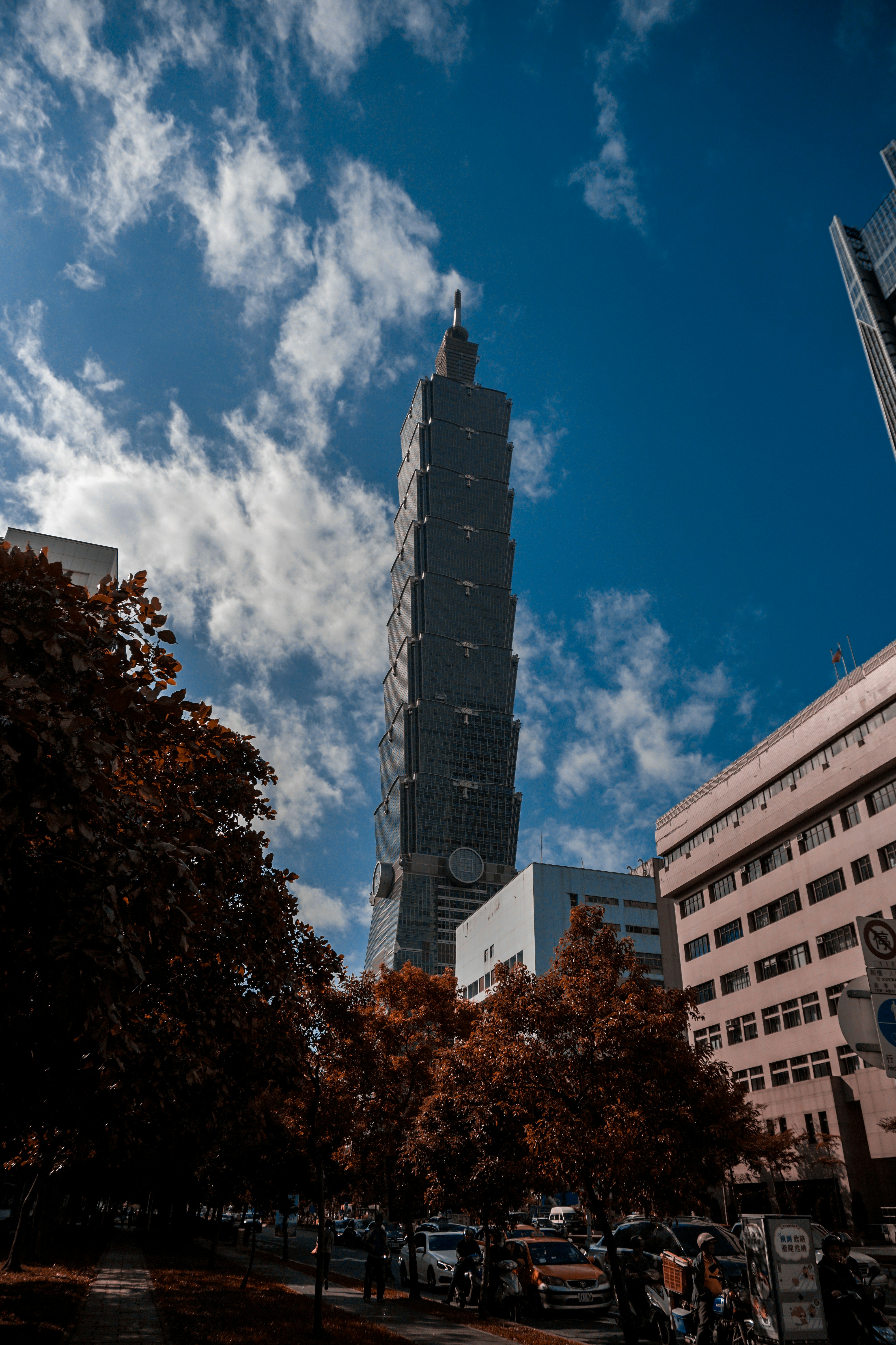 Skyward Icon: Taipei 101 Rises Over Autumn Streets