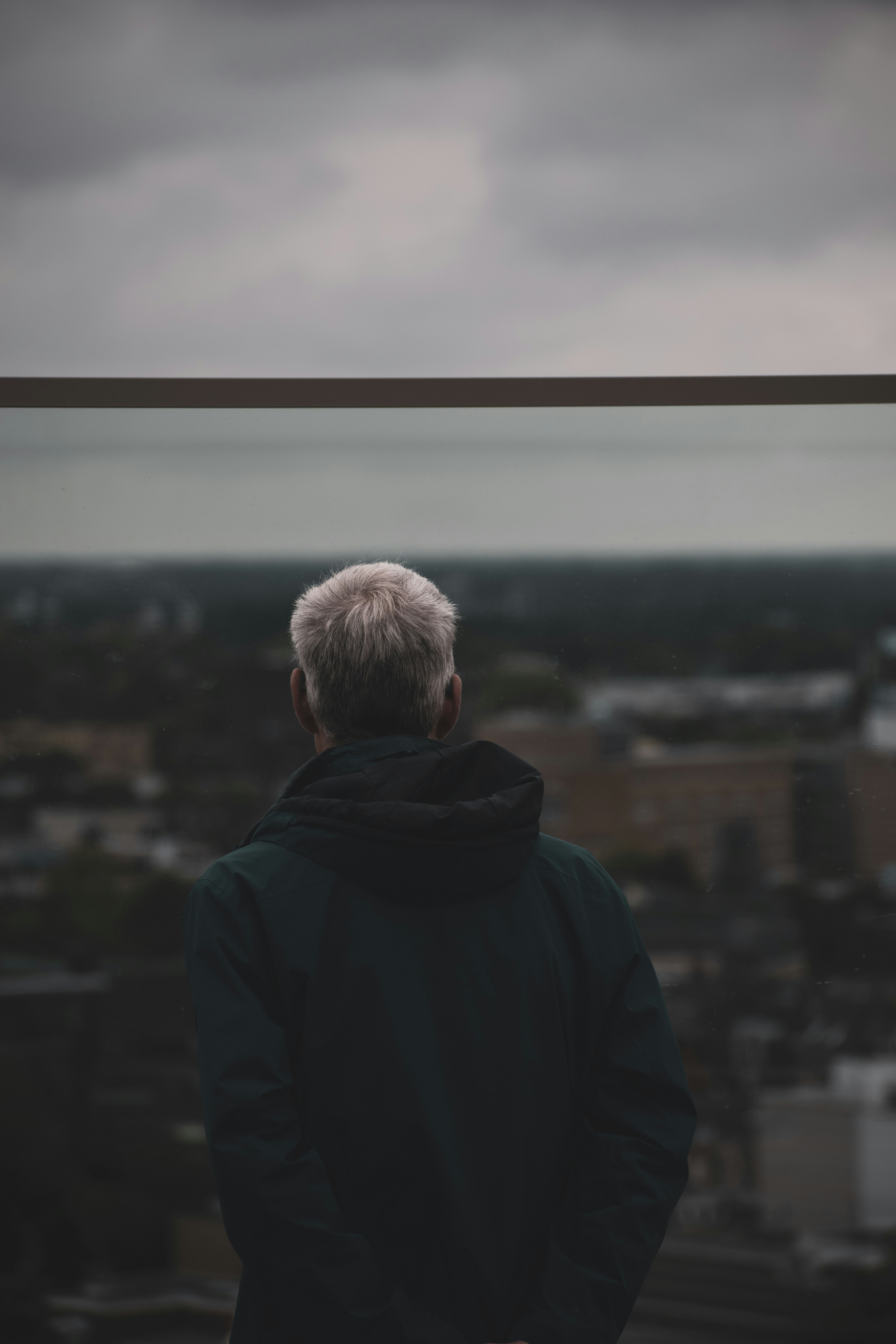 Backlit Rooftop Gaze: A Moment Above the City