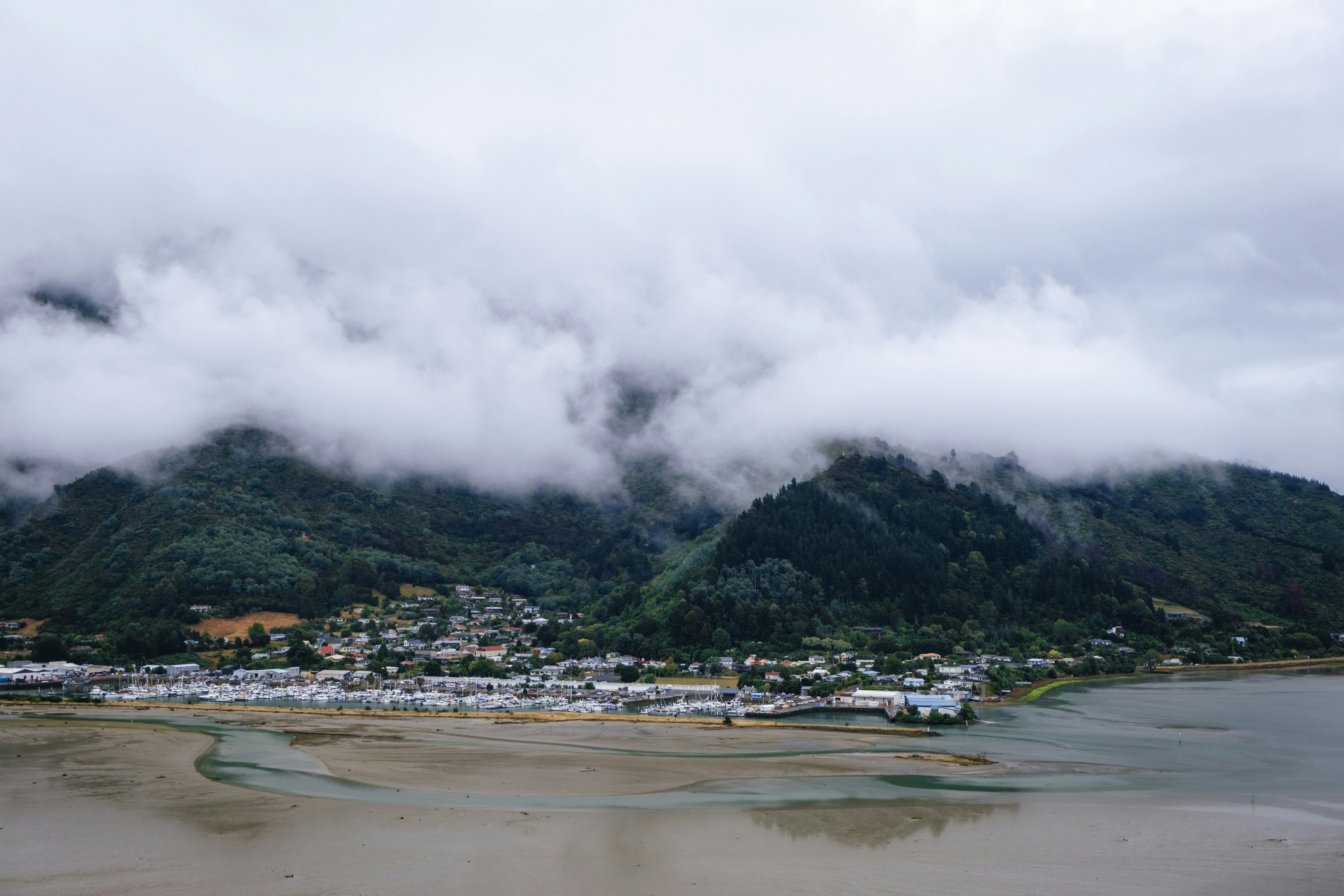 Low-Tide Shallows and Cliffside Village