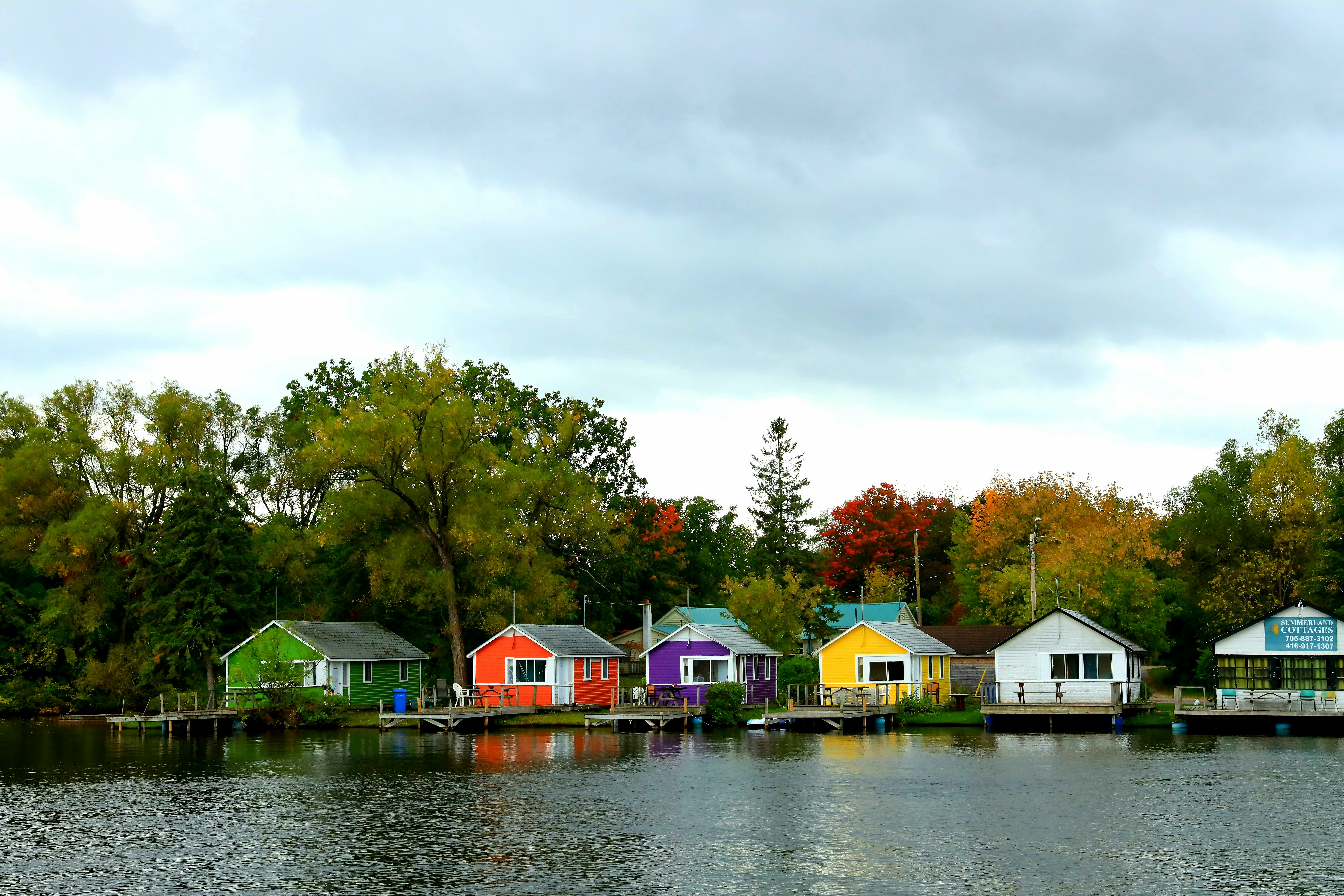Colorful Waterfront Cabins Reflecting a Quiet Autumn