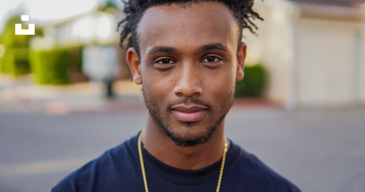 Man In Blue Crew Neck Shirt Wearing Gold Necklace Photo Free Headshot