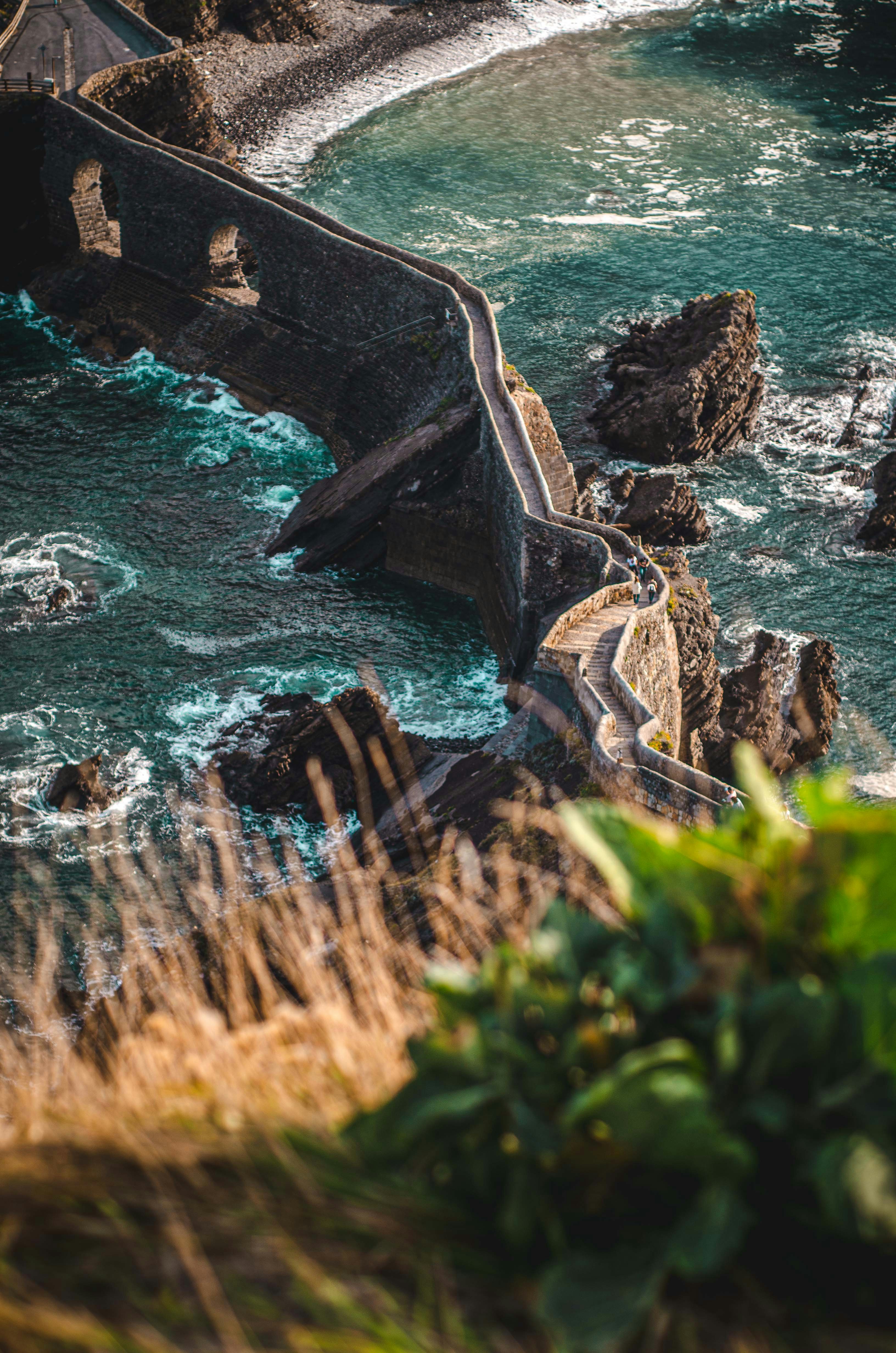 Winding Staircase Along Turquoise Tide Between Granite Cliffs