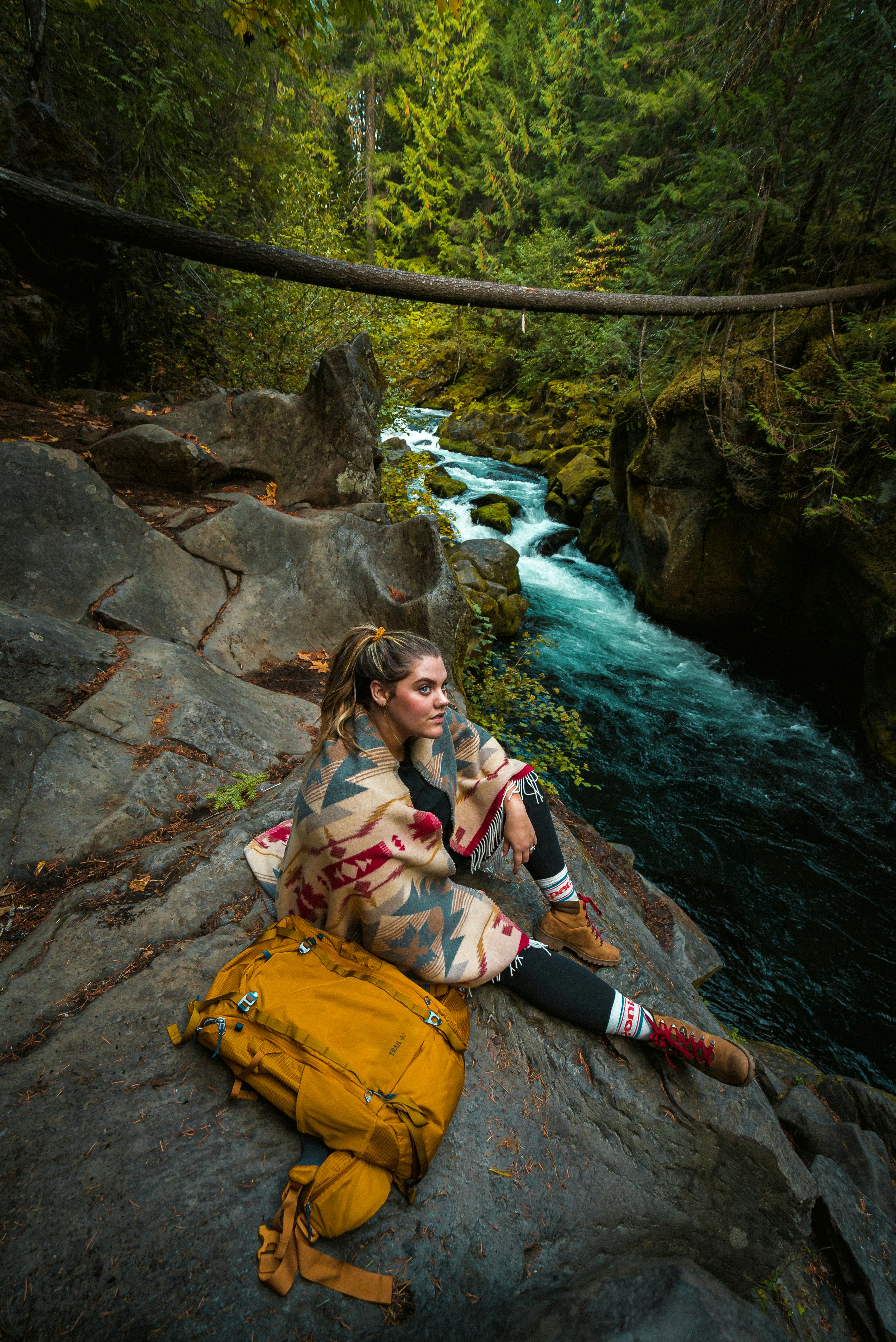 Cozy Wanderer on Rugged Granite by a Turquoise Forest River