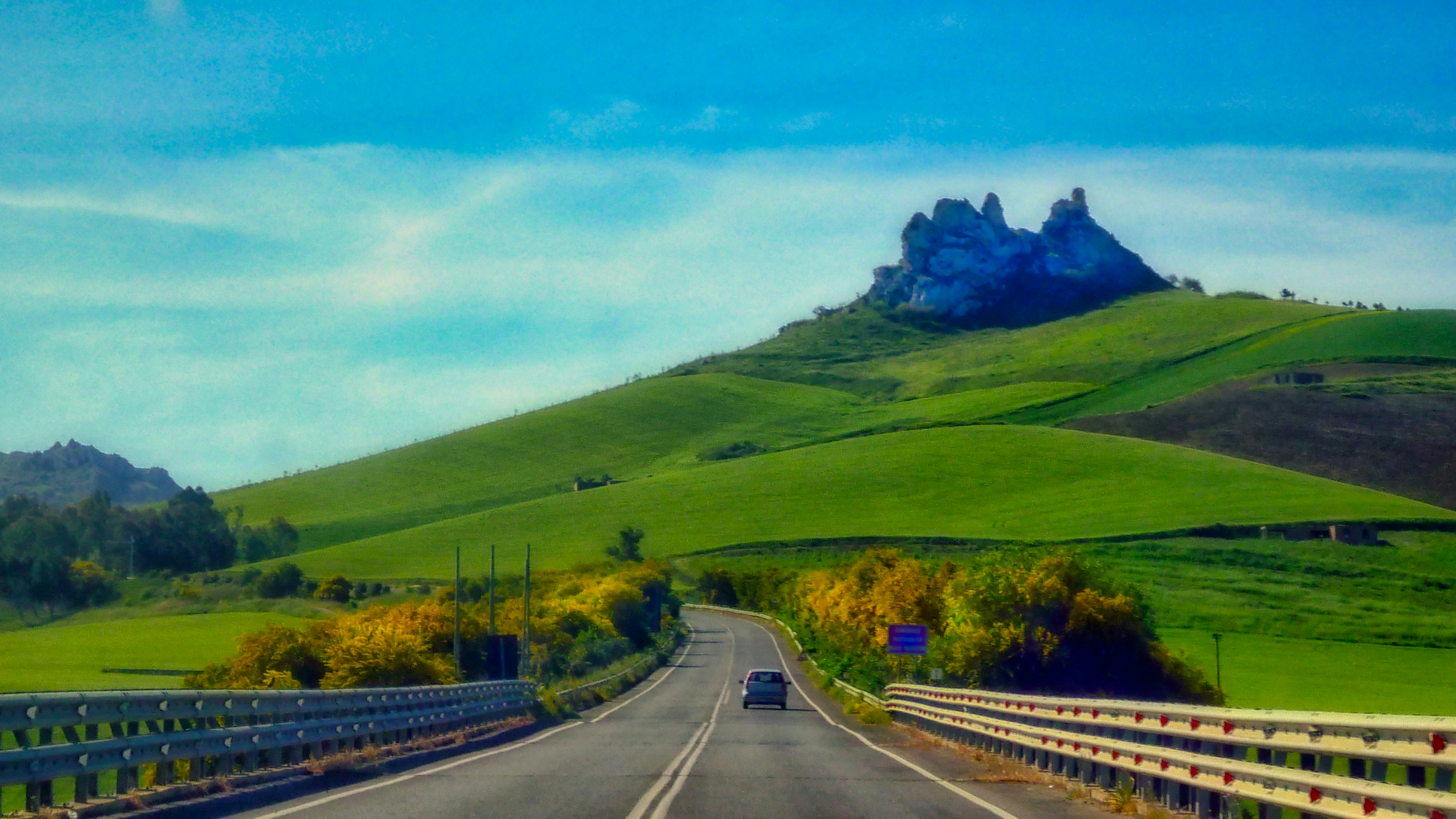 Road Toward the Granite Crown Across Emerald Hills