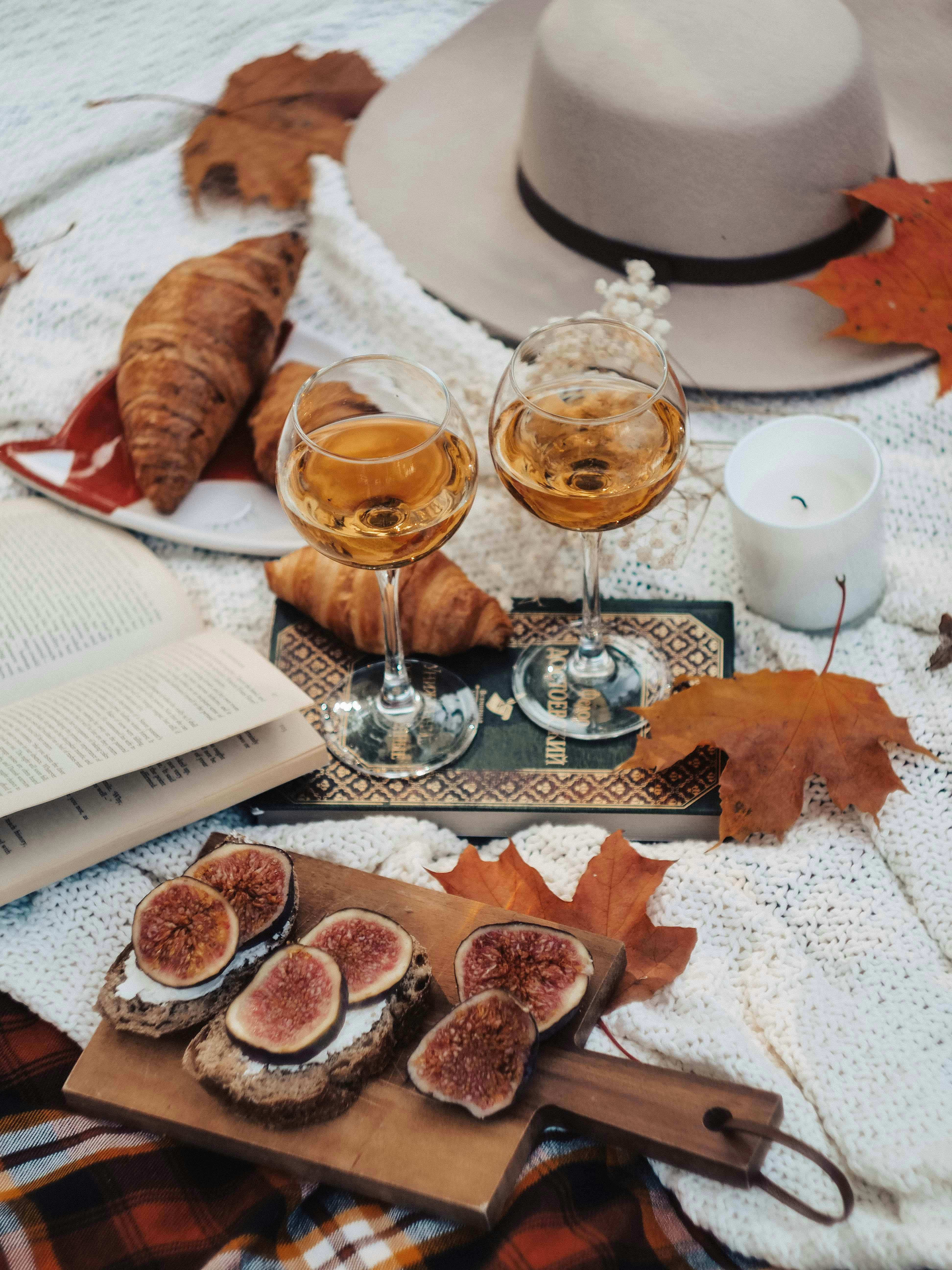Autumn Toasts: Wine Glasses, Croissants, and Figs on a Cozy Blanket