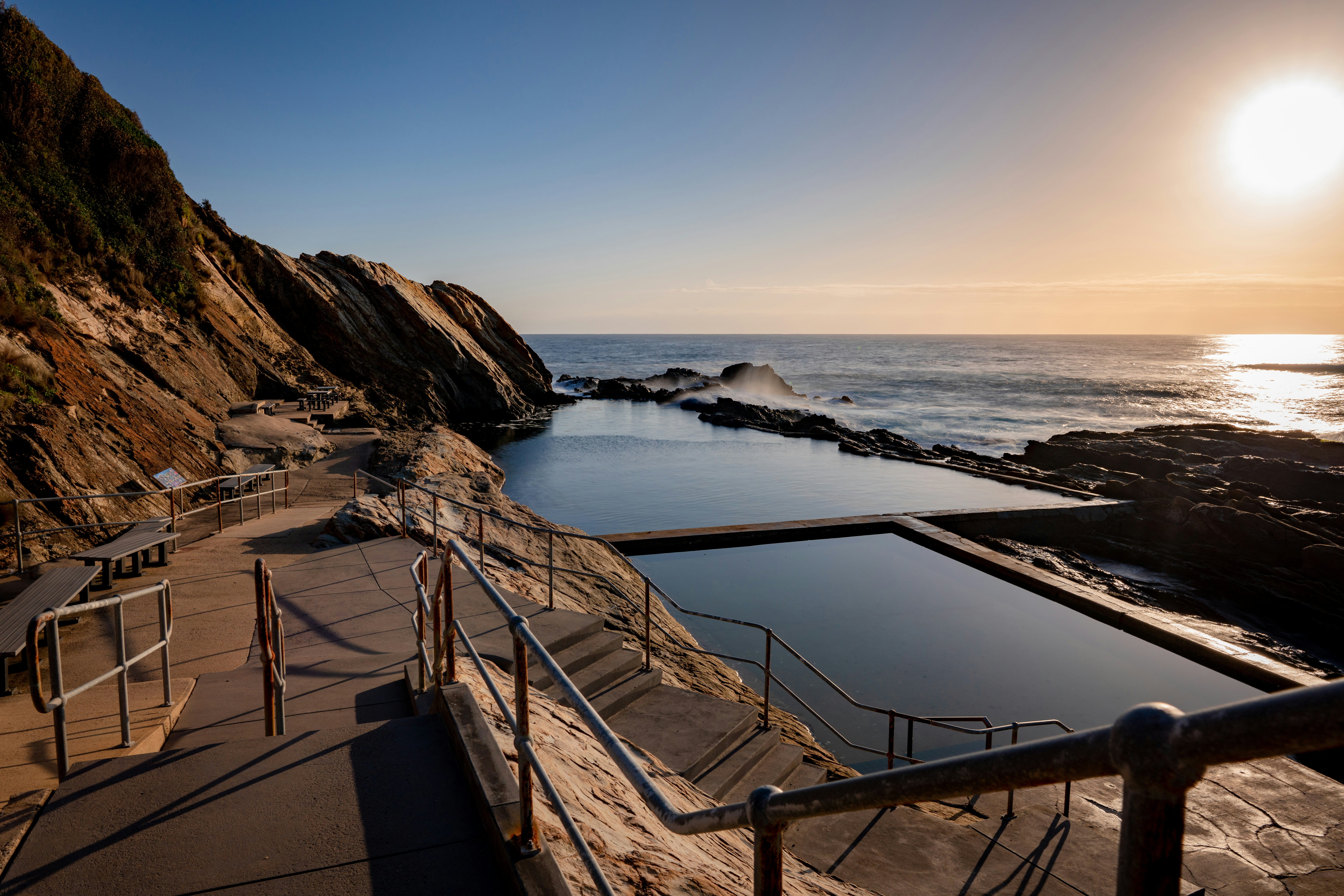 Sunlit Tide Pools at the Cliff Stairway
