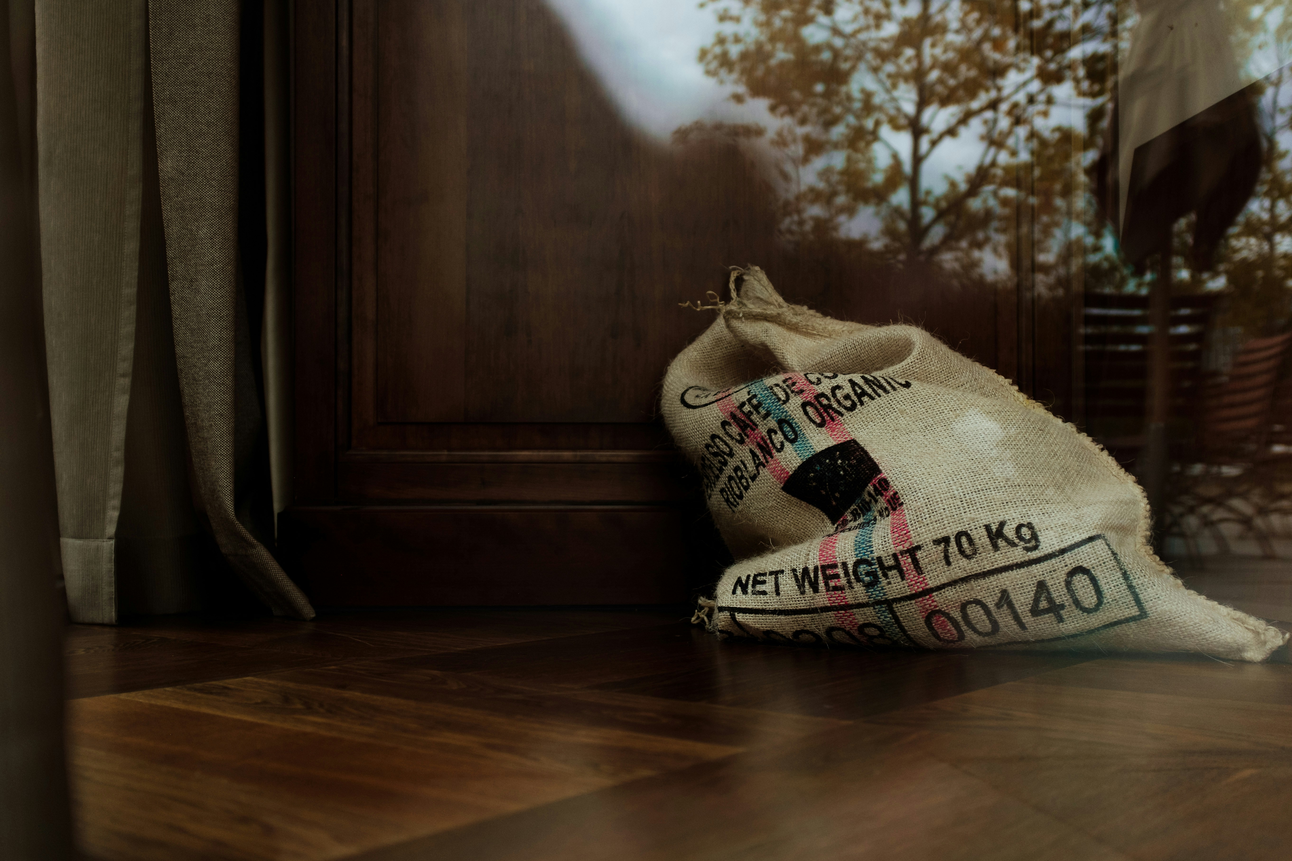 A Burlap Sack on a Wooden Floor: Quiet Porch Sunlight