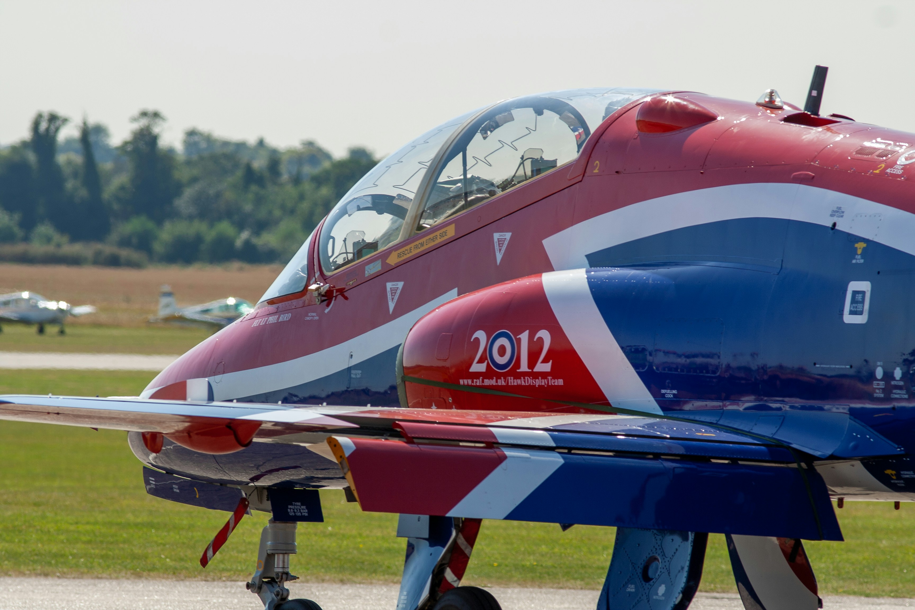 Blue and red jet plane on green grass field during daytime photo – Free ...