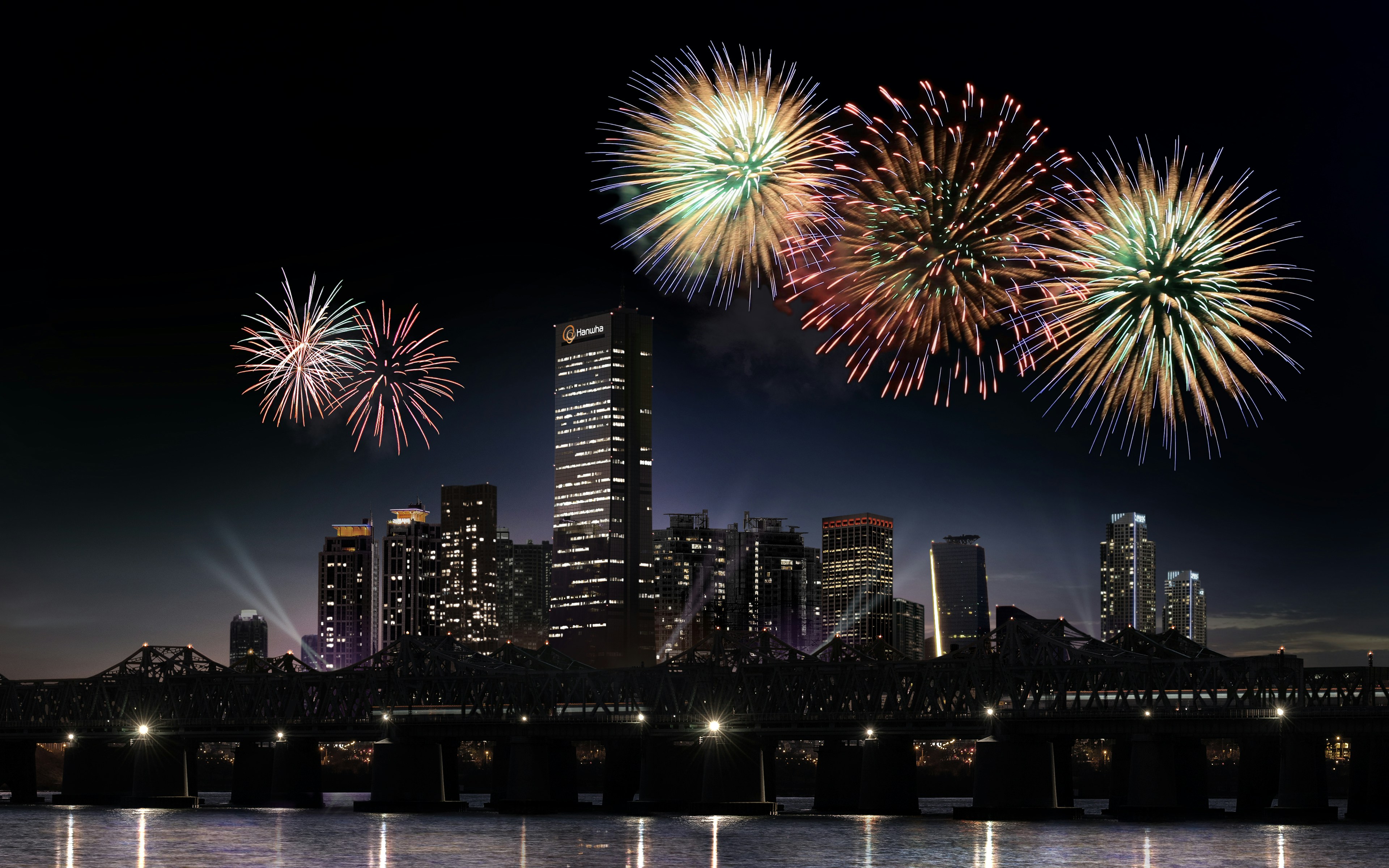 Fireworks display over city buildings during night time photo – Free ...