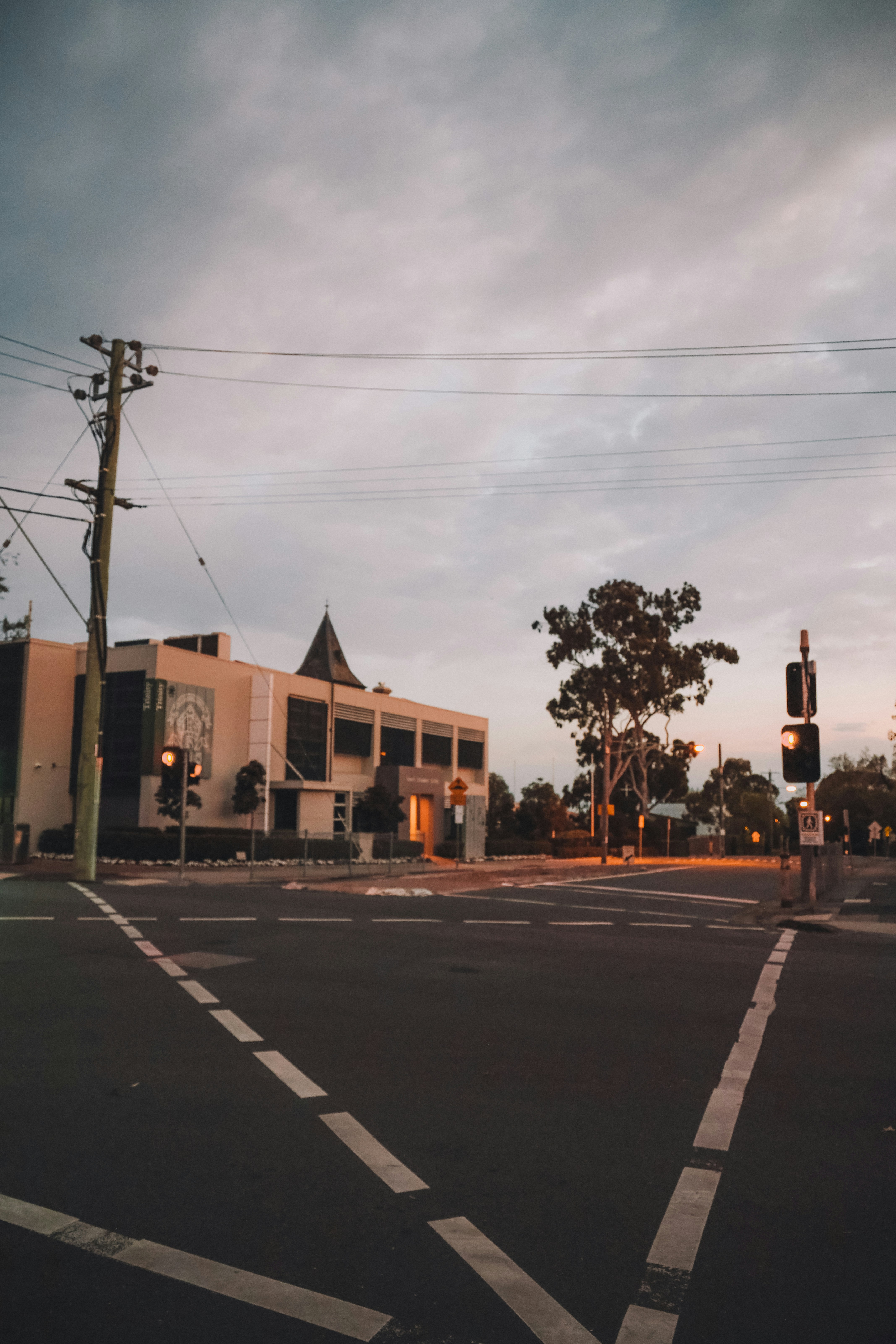 brown concrete building near green trees during daytime