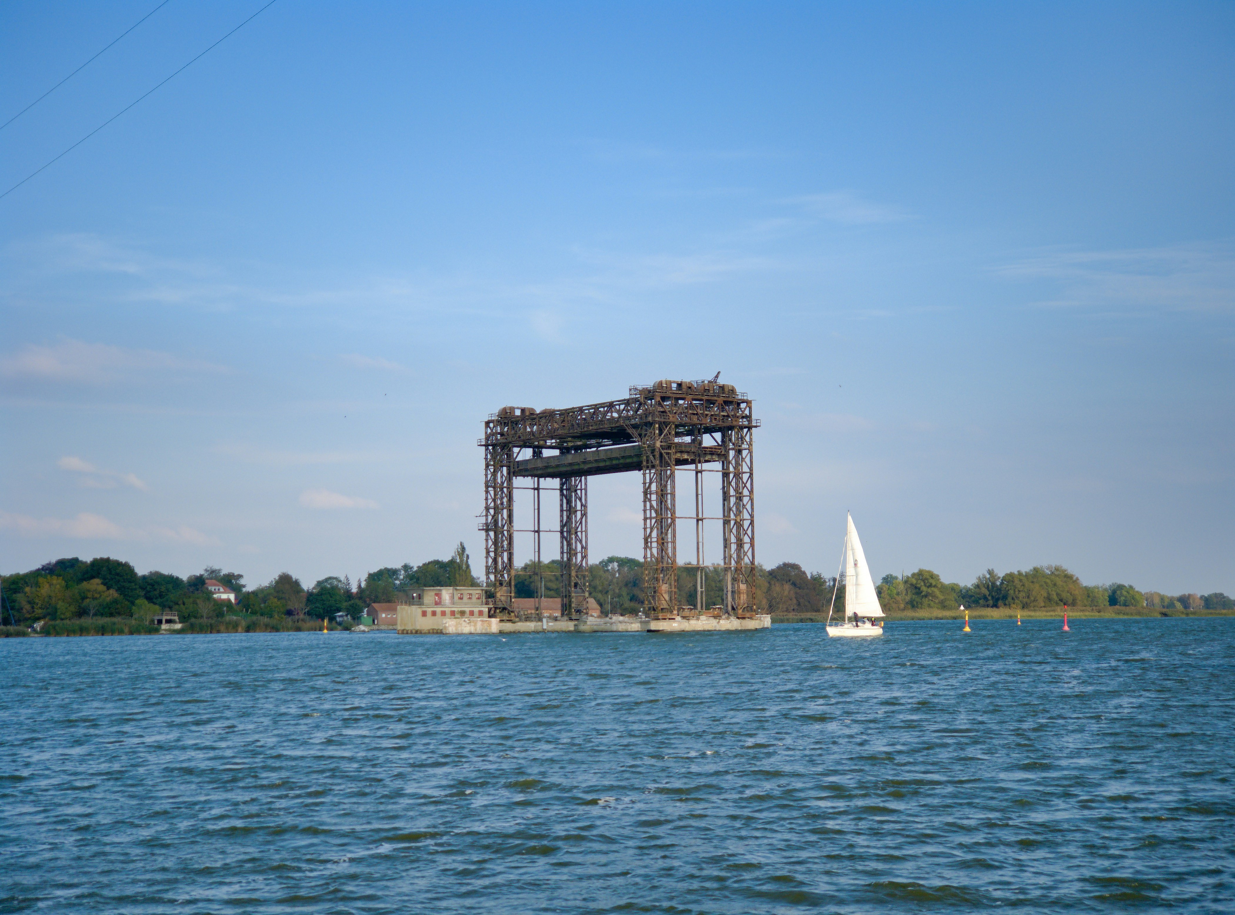 Sailboat Beside Industrial Relic