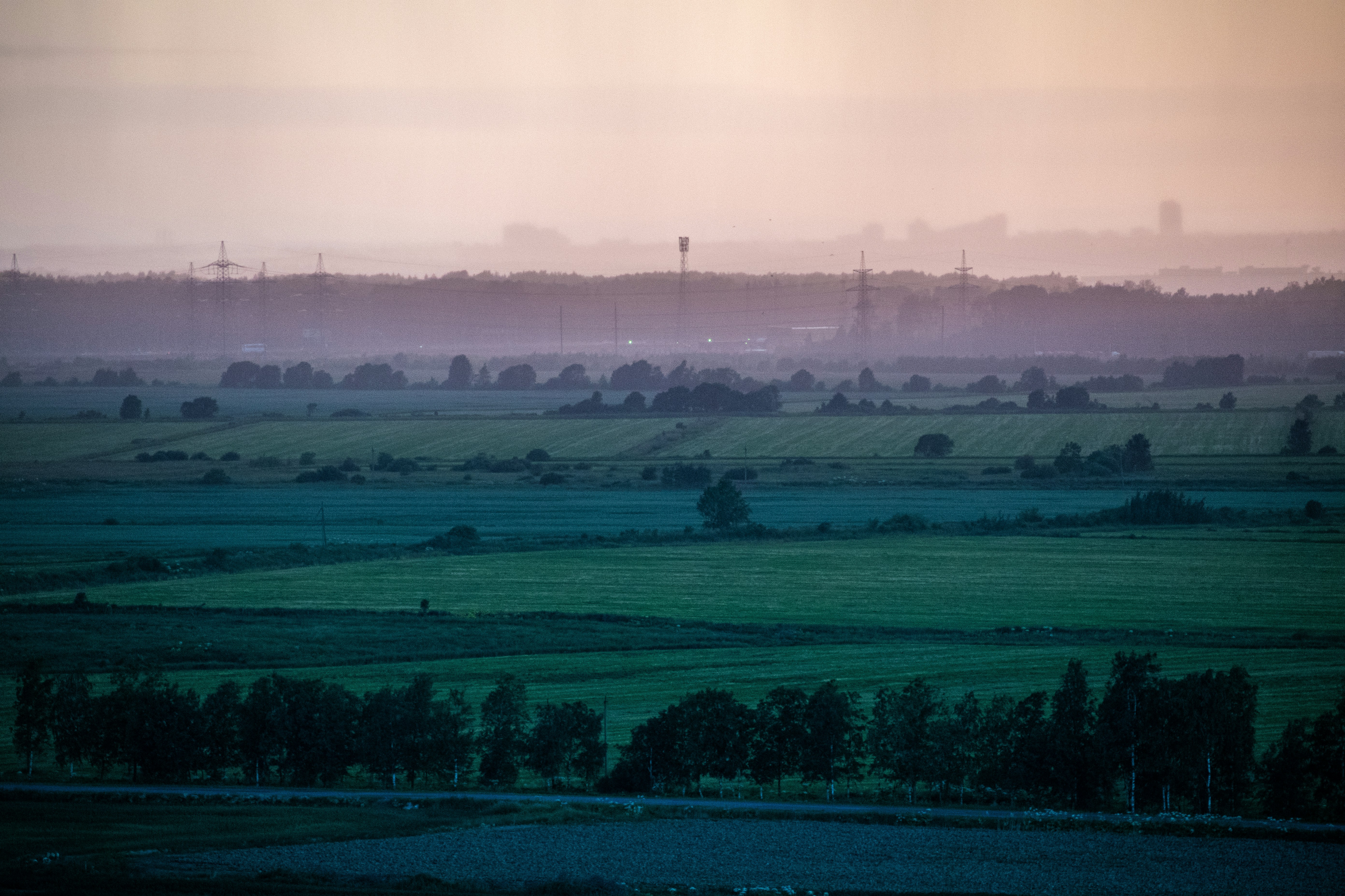 Dusk Horizon: The Distant Tower Over Layered Fields