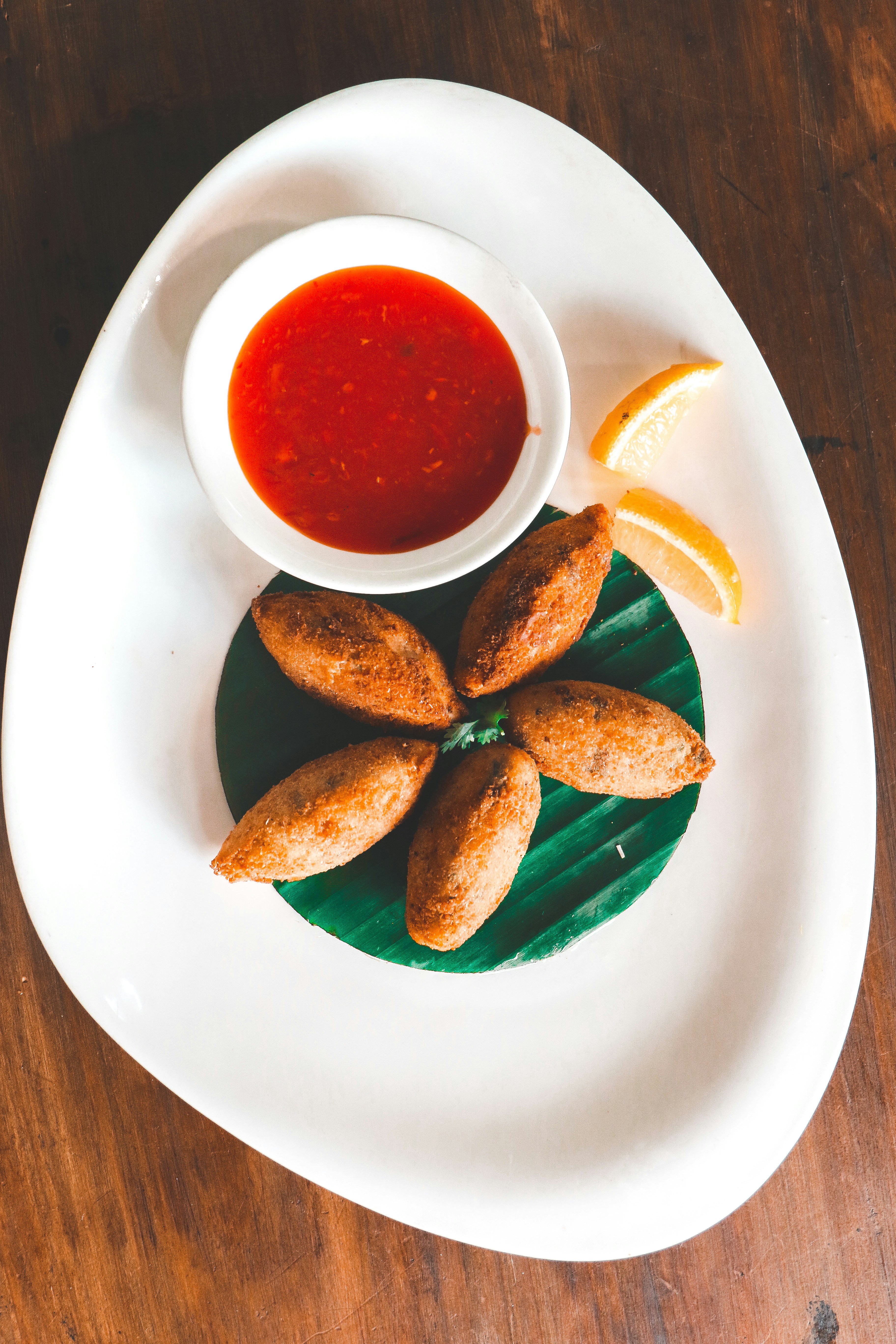 Breakfast (Ing;Mandazi,ketchup,sliced oranges)