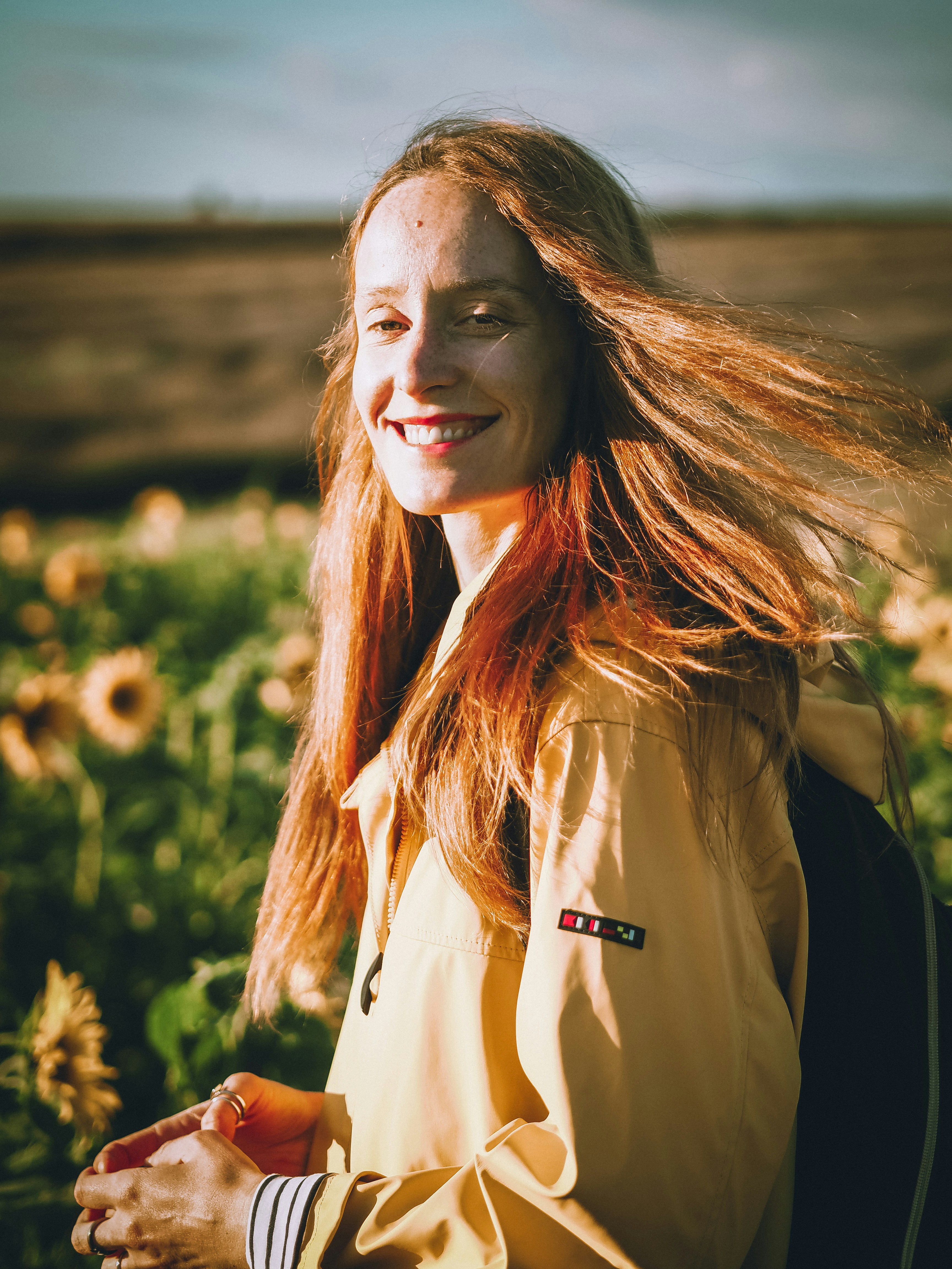Wind-Driven Portrait in a Field of Sunflowers