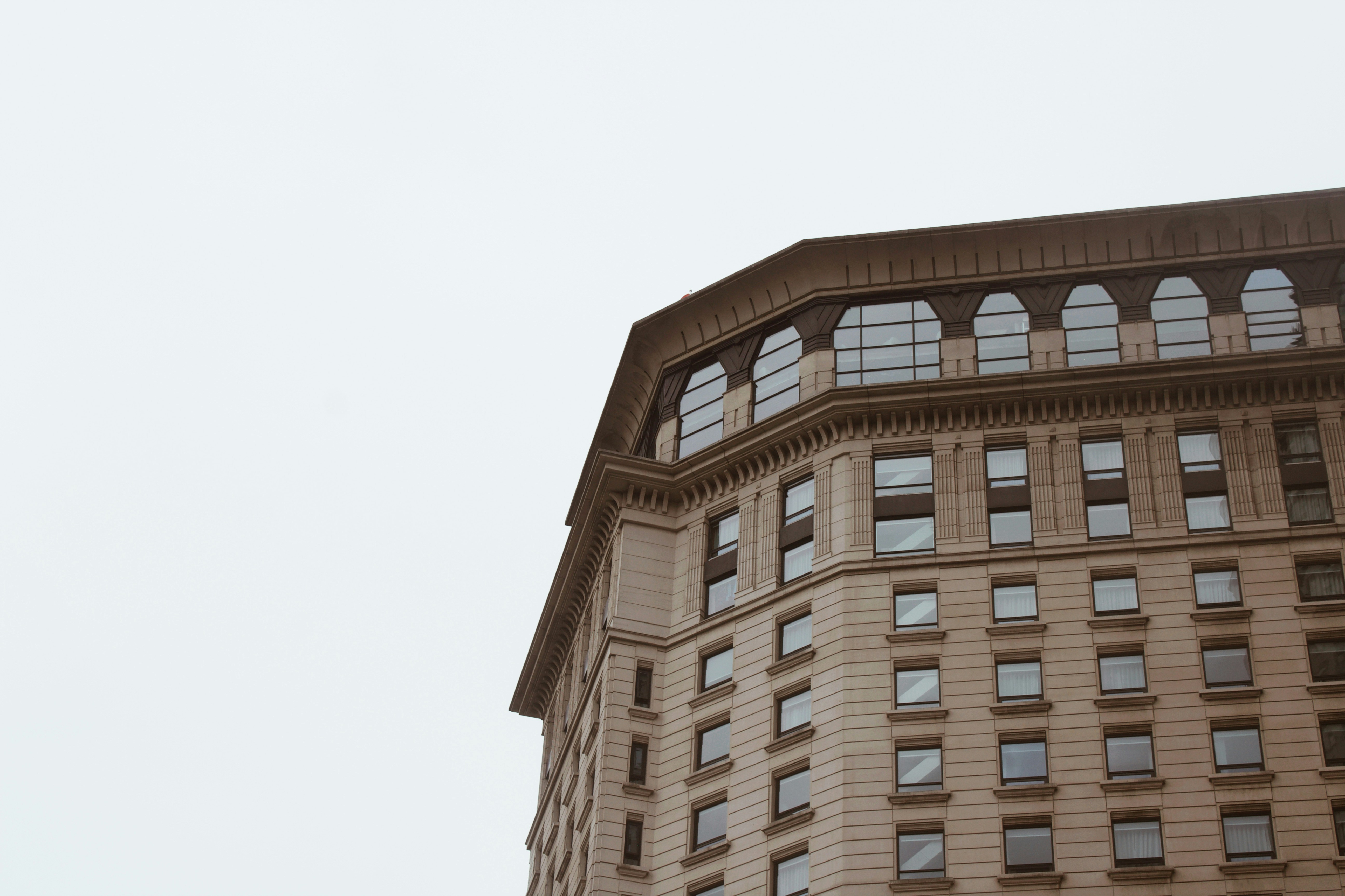 Urban Stone Crown: Corner Facade Reaching Toward the Sky