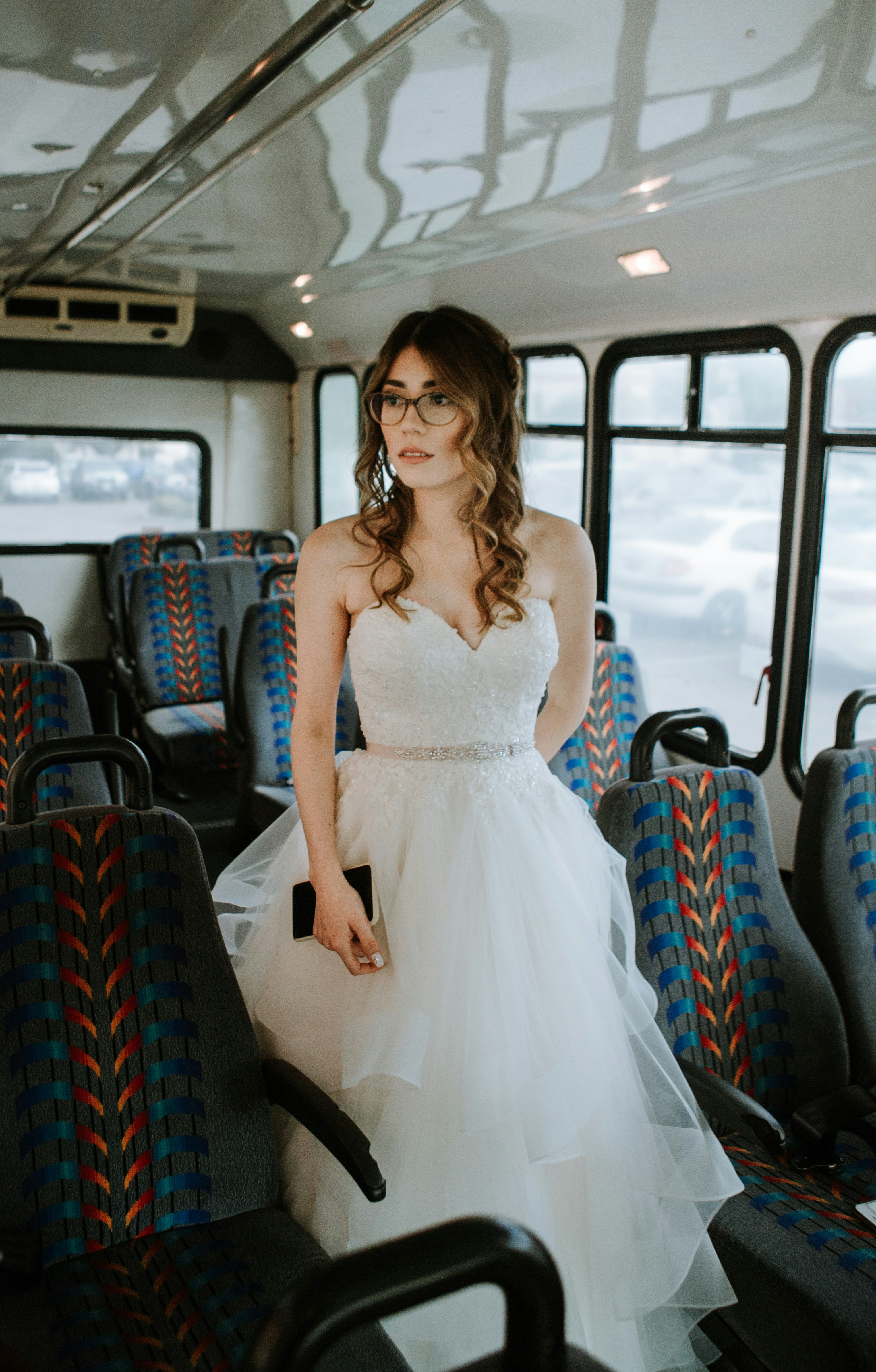 Aisle of Quiet Grace: Bride in White on a City Bus