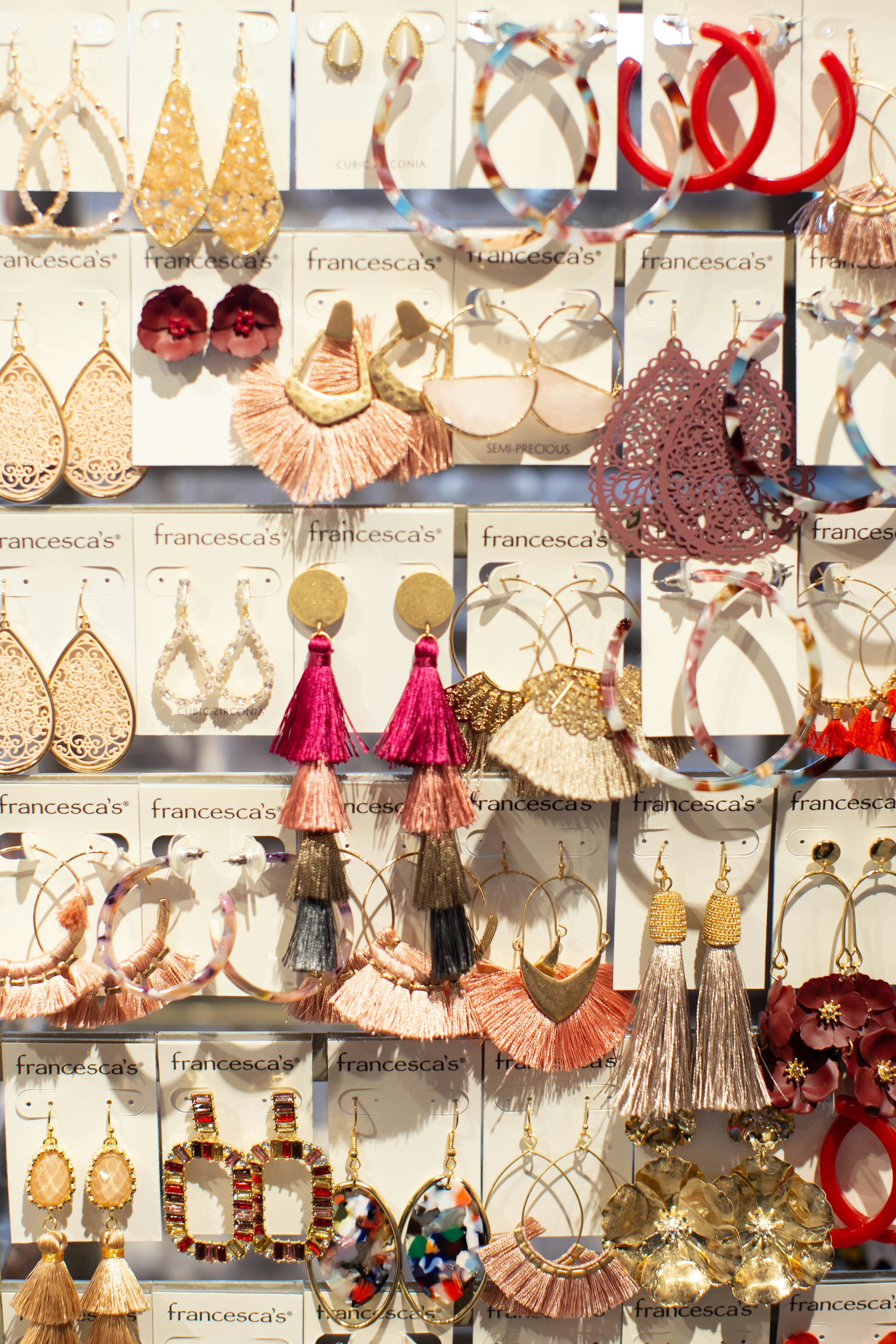 Carousel of Color: Tassels and Lace Adorning a Jewelry Wall