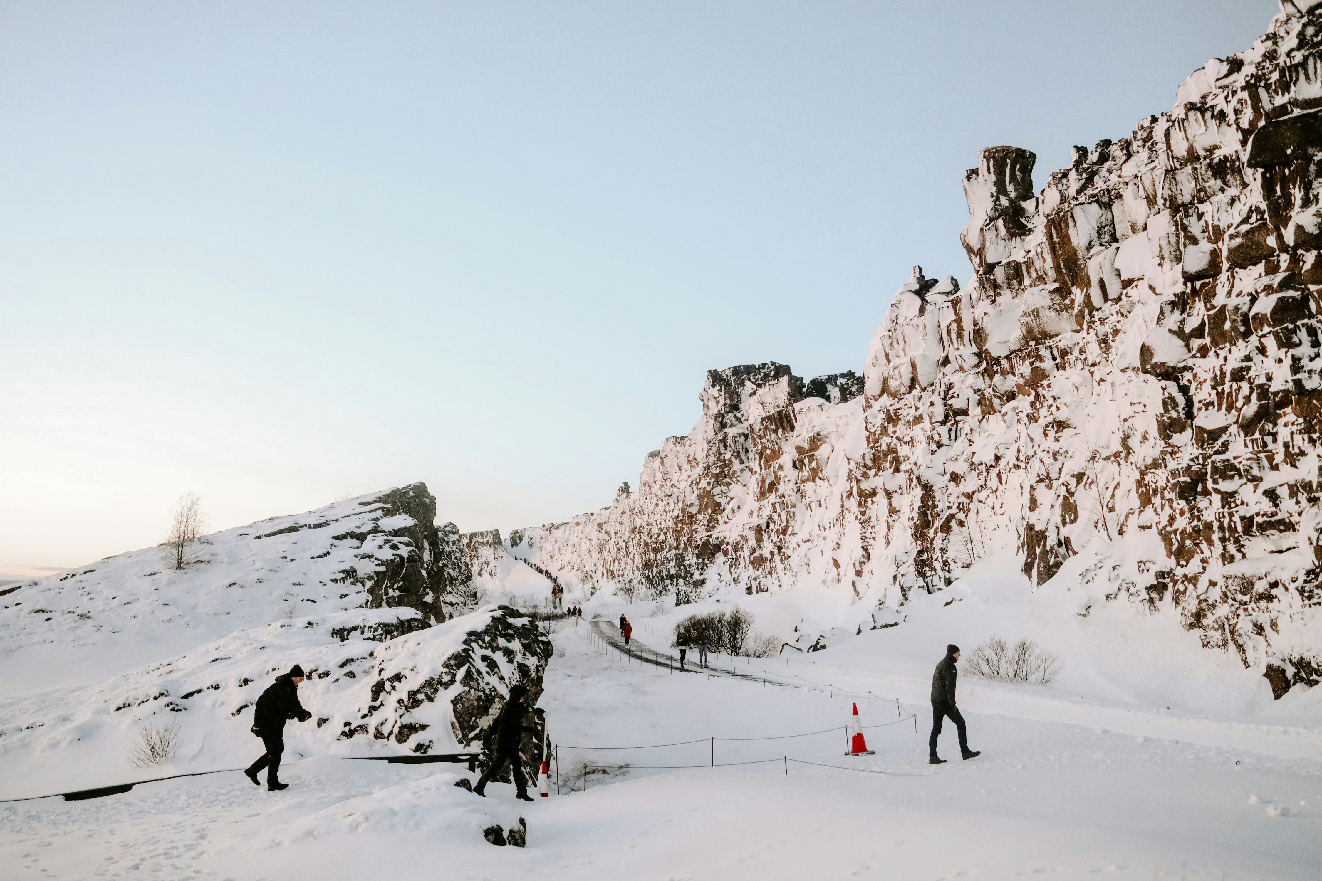 Ridge Under Snow: Climbers Tread a Granite Wall