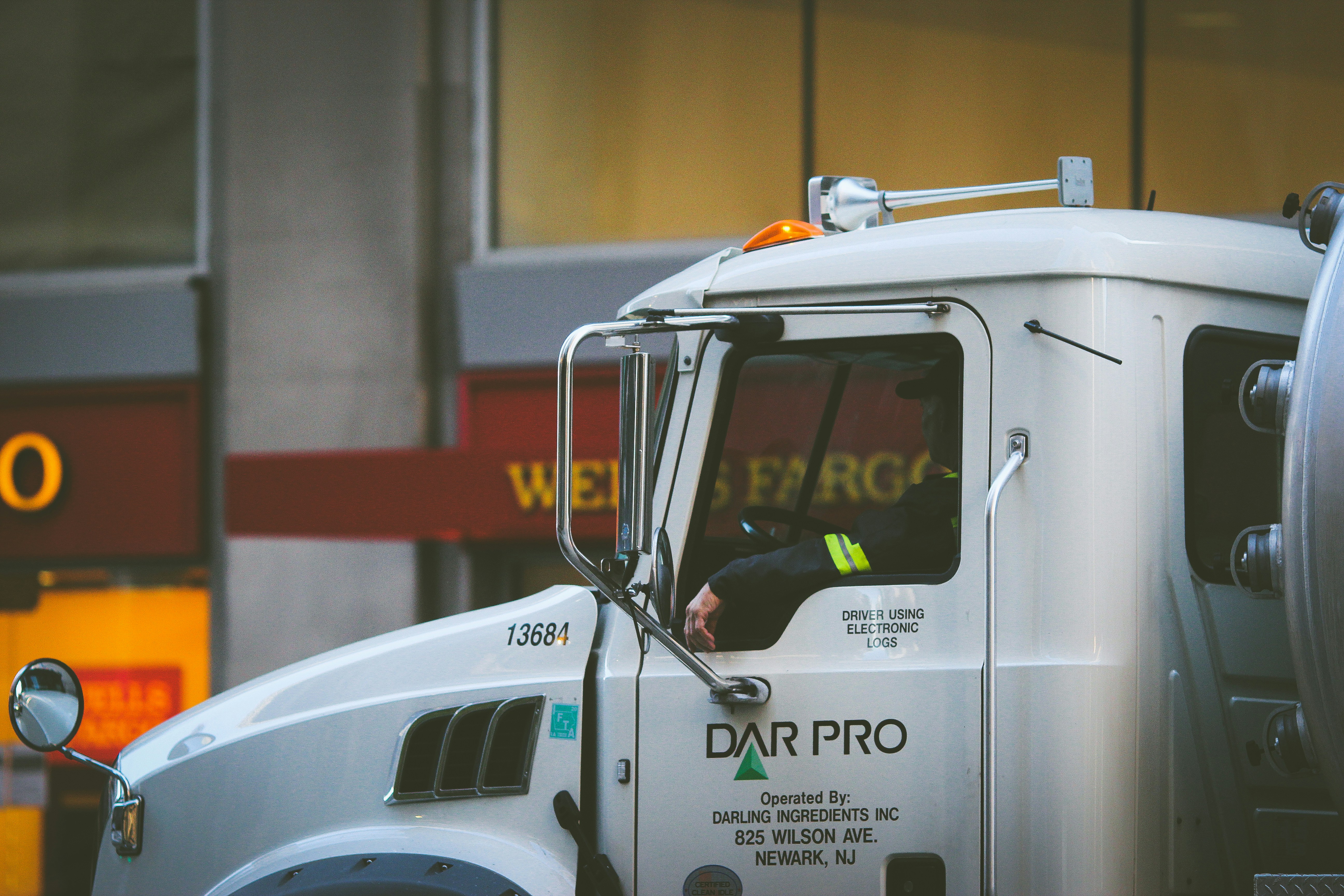 Dawn Patrol at the Cab: A City Truck Framed by Glass and Glow