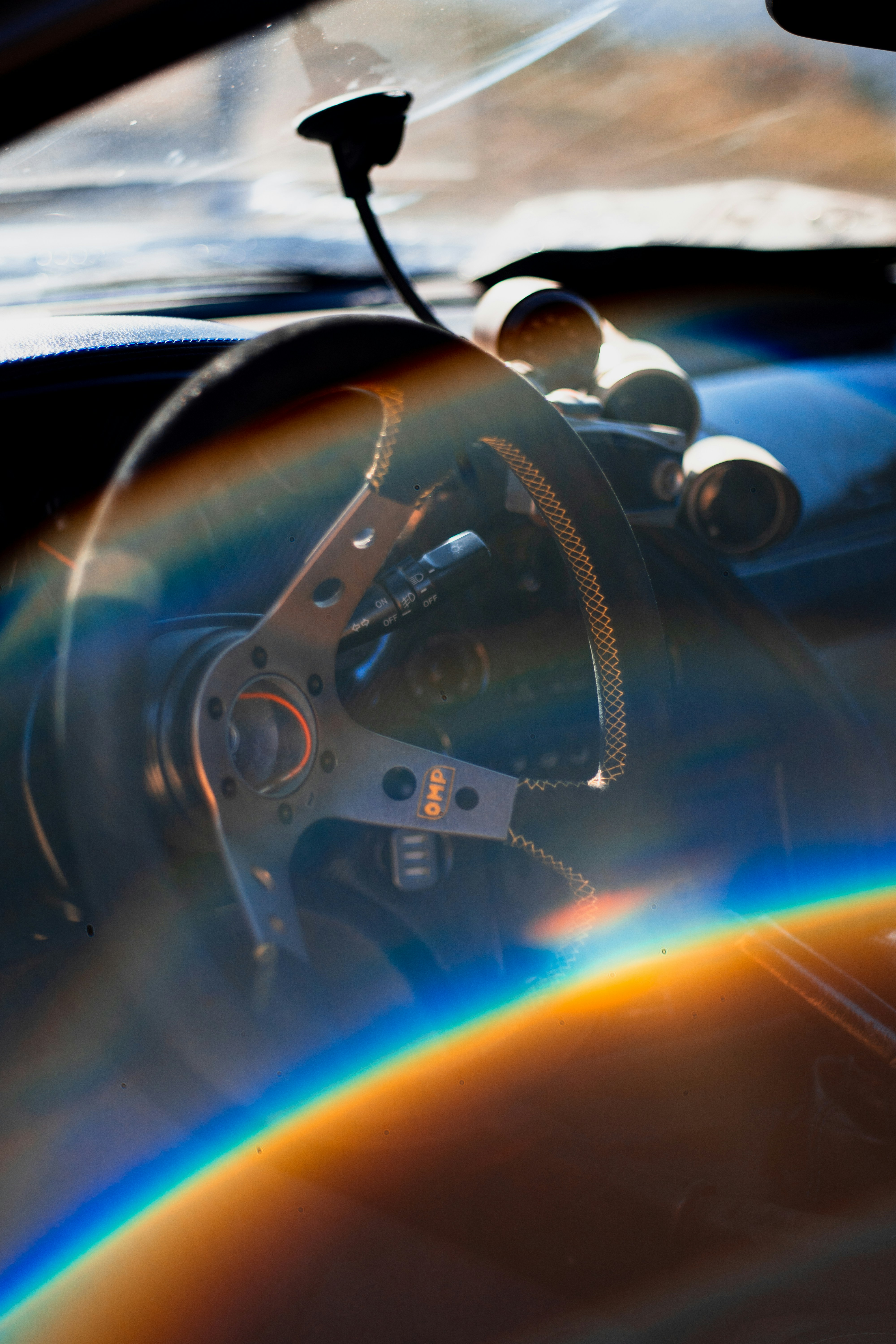 Prismatic Cockpit: The Racing Wheel Awash in Prism Light