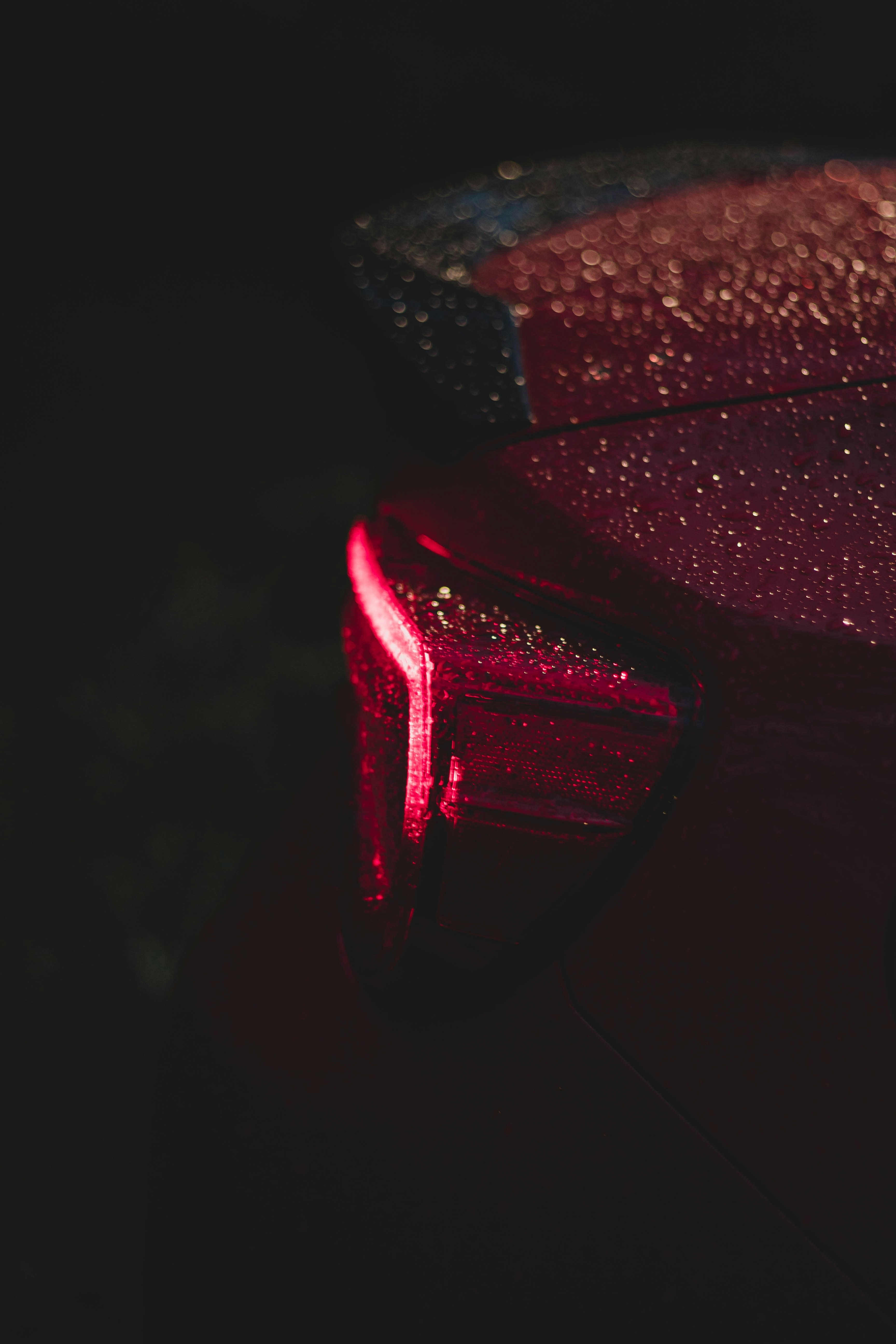 Glistening Raindrops on Ruby Tail Light