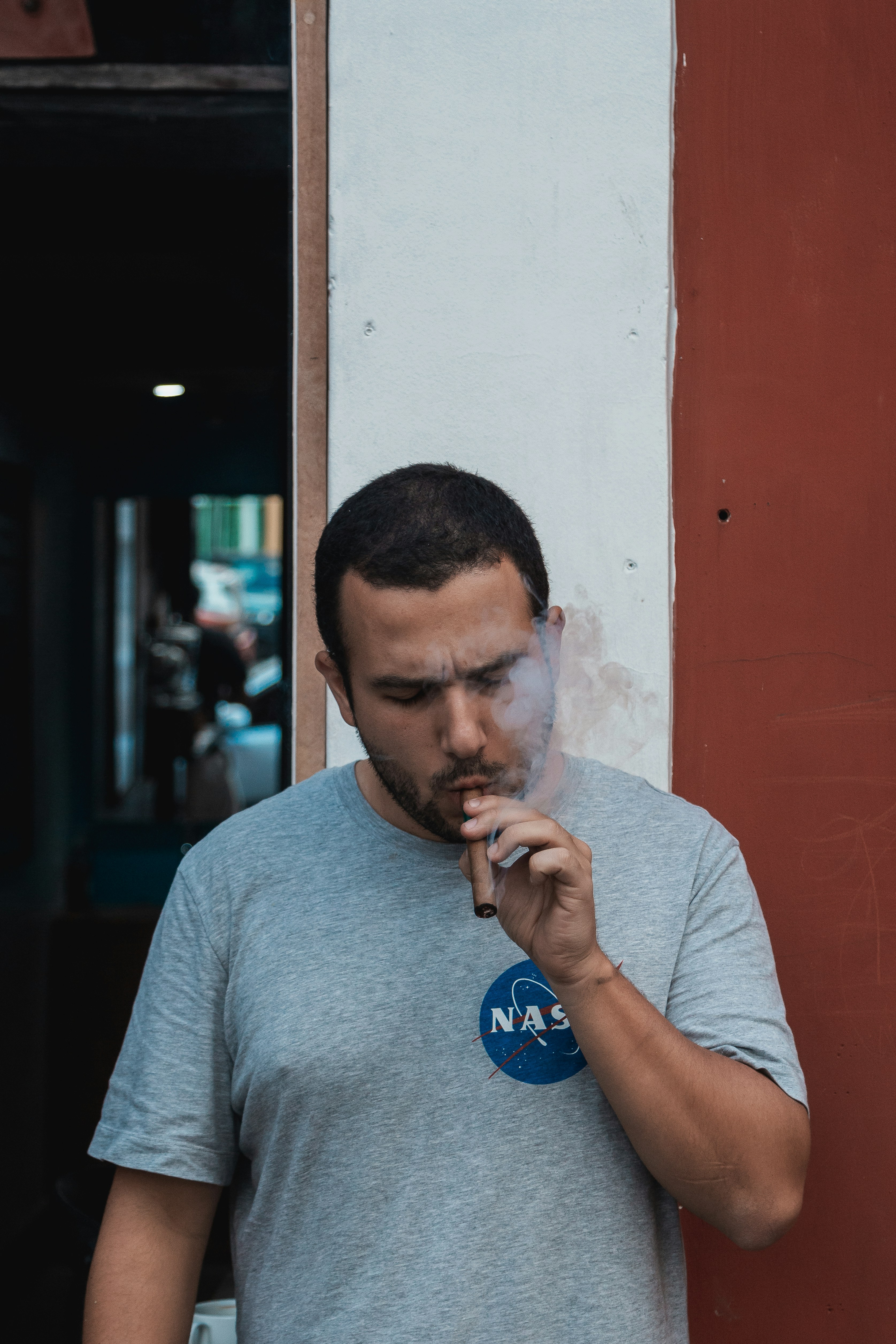 Smoke Break at the Threshold: a quiet moment by the doorway