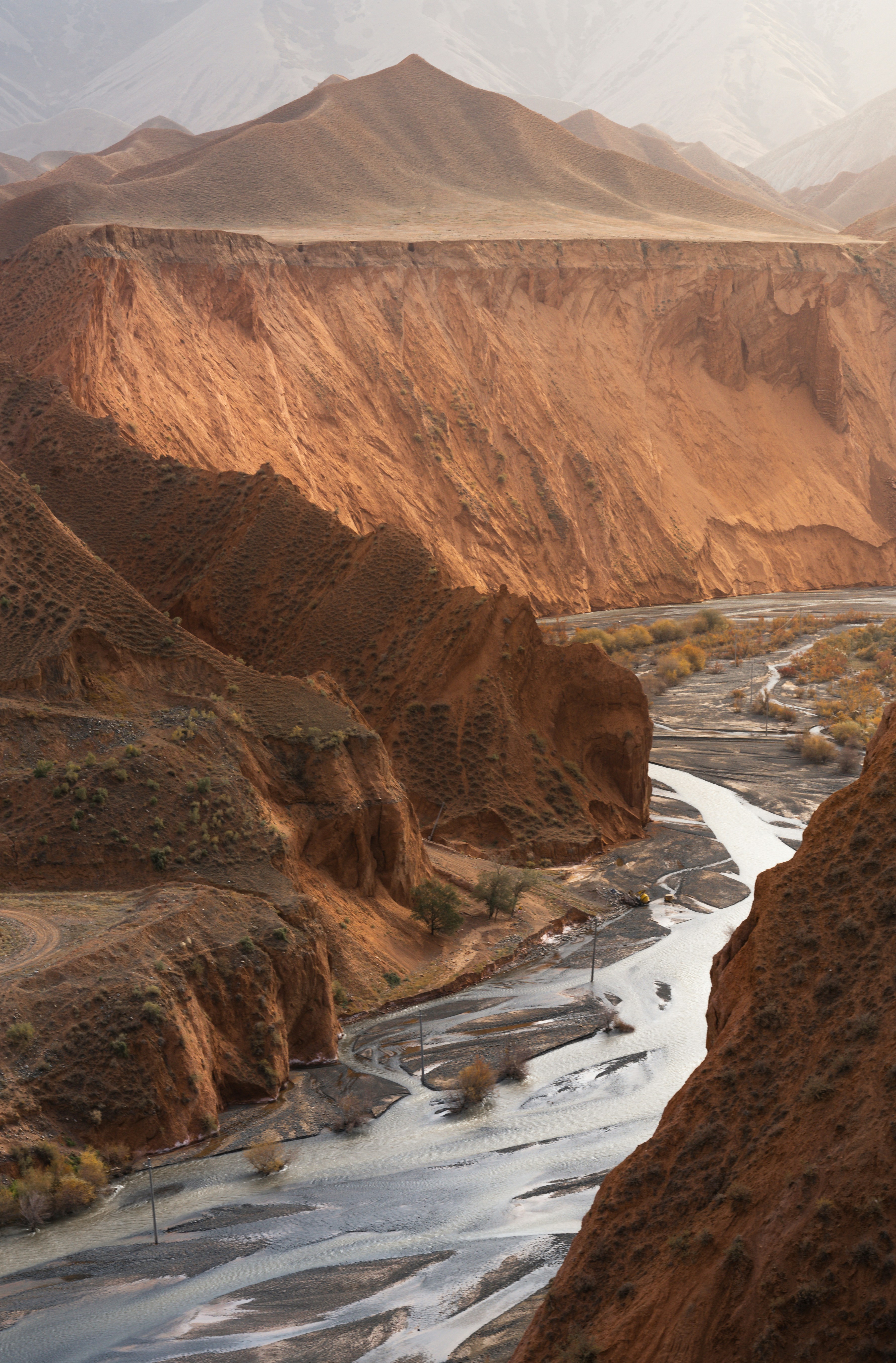 Rust and River: A Winding Cascade Through Arid Cliffs