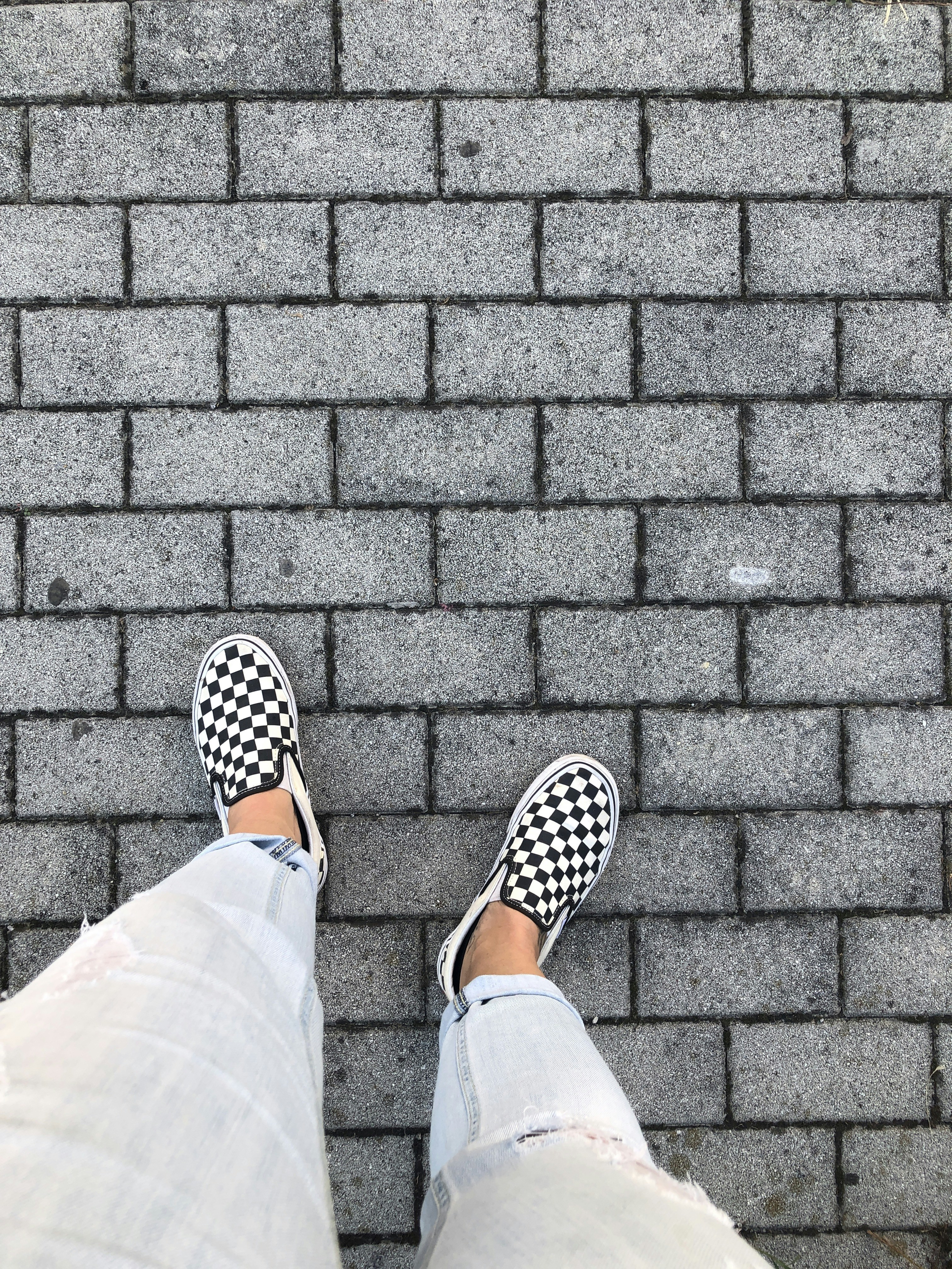 Checkerboard Kicks on Gray Cobble: A Wearer’s Street-Level View