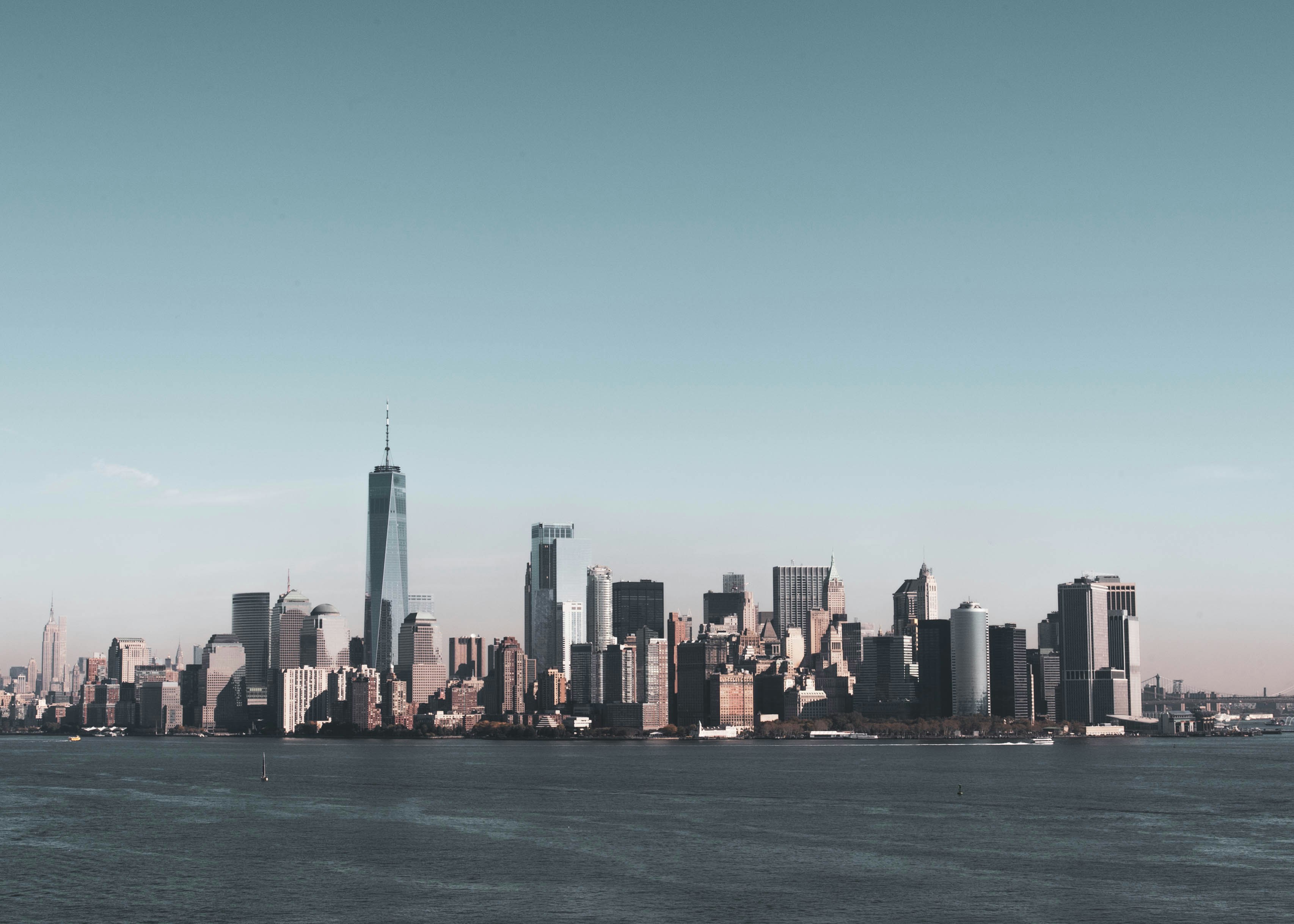 city skyline under blue sky during daytime