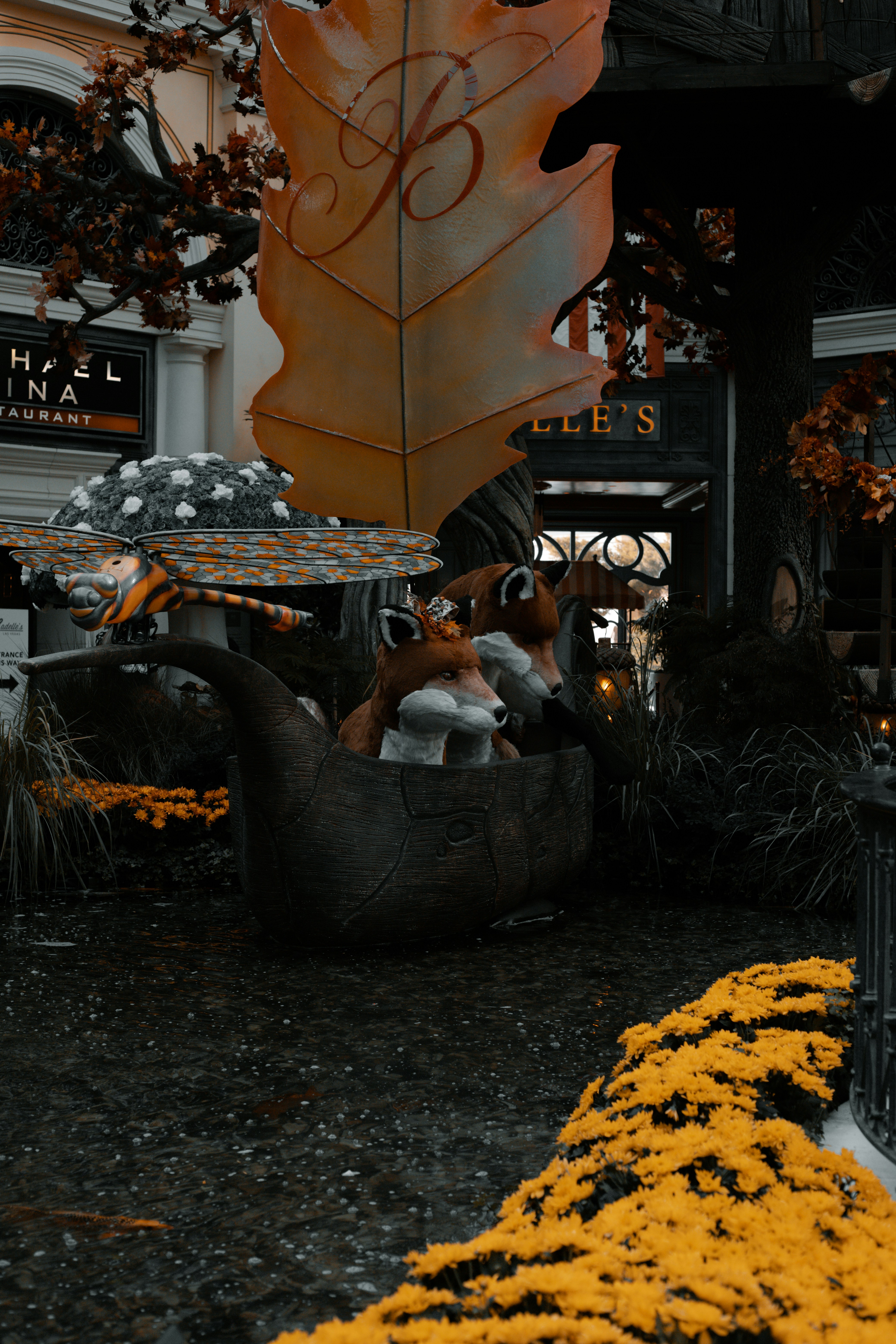 Autumn Leaf Monument Over a Playful Boat Scene in a Courtyard
