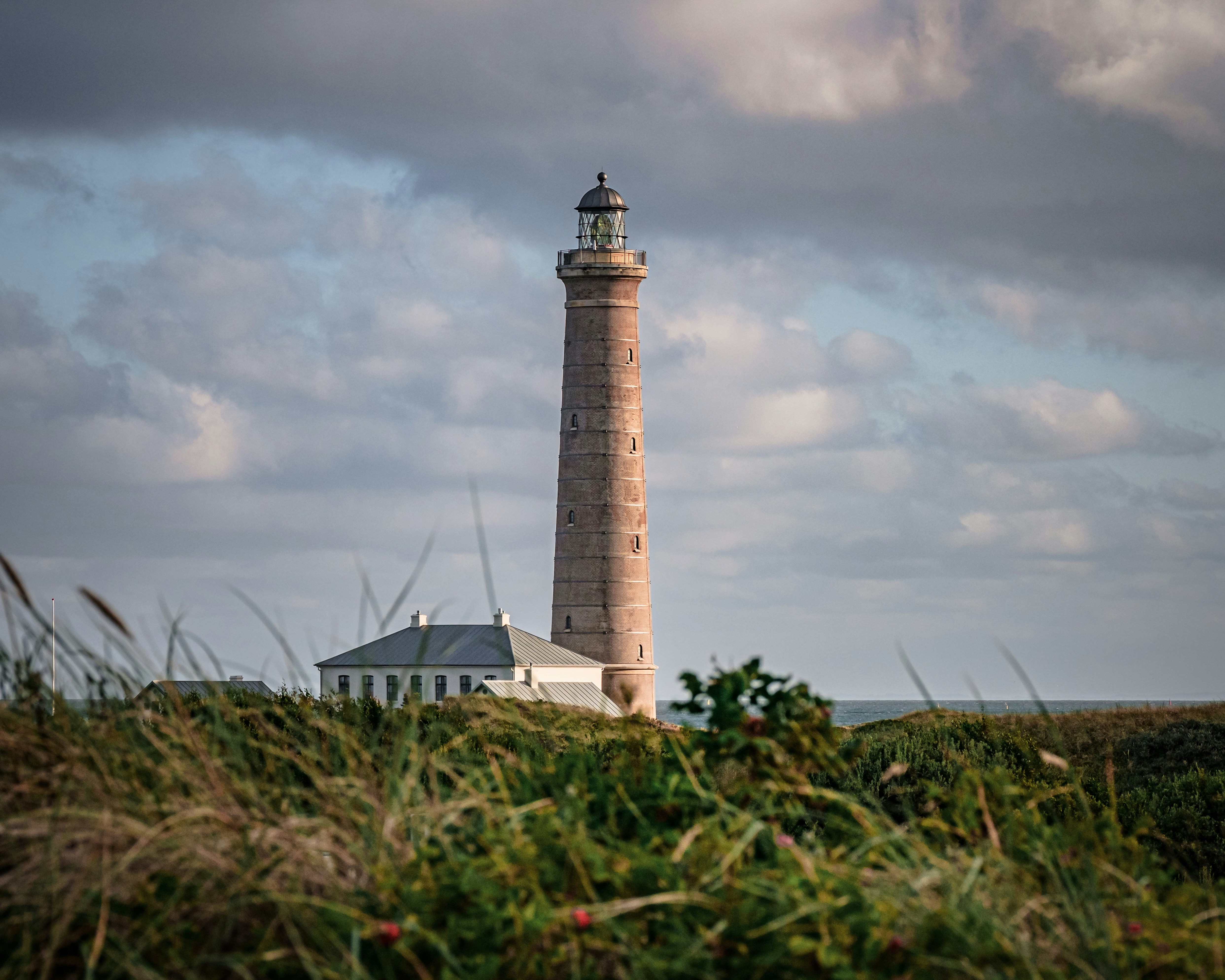 White and brown lighthouse under cloudy sky during daytime photo – Free ...