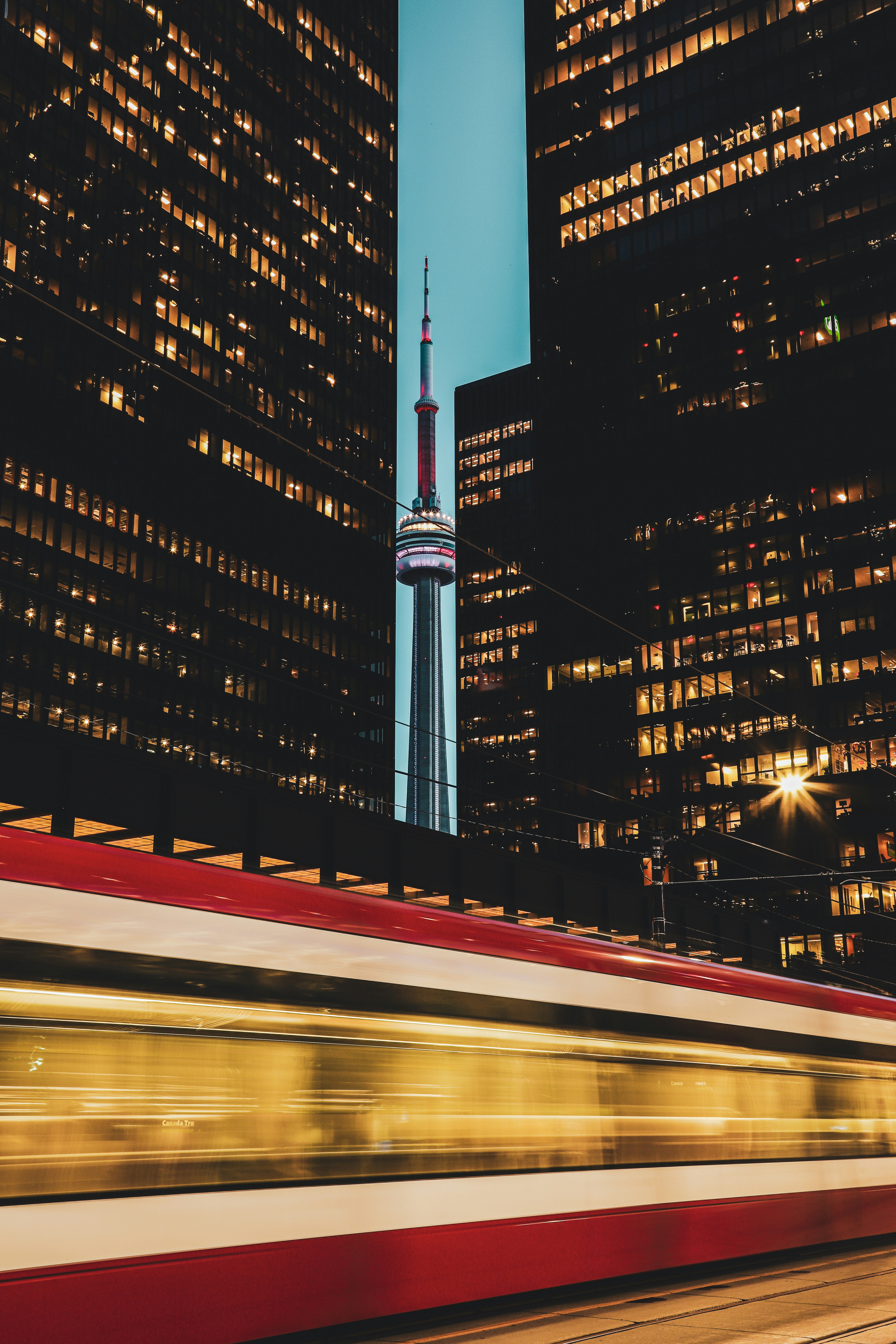 Twin Towers, a Neon Needle: Midnight Transit through a City Veil