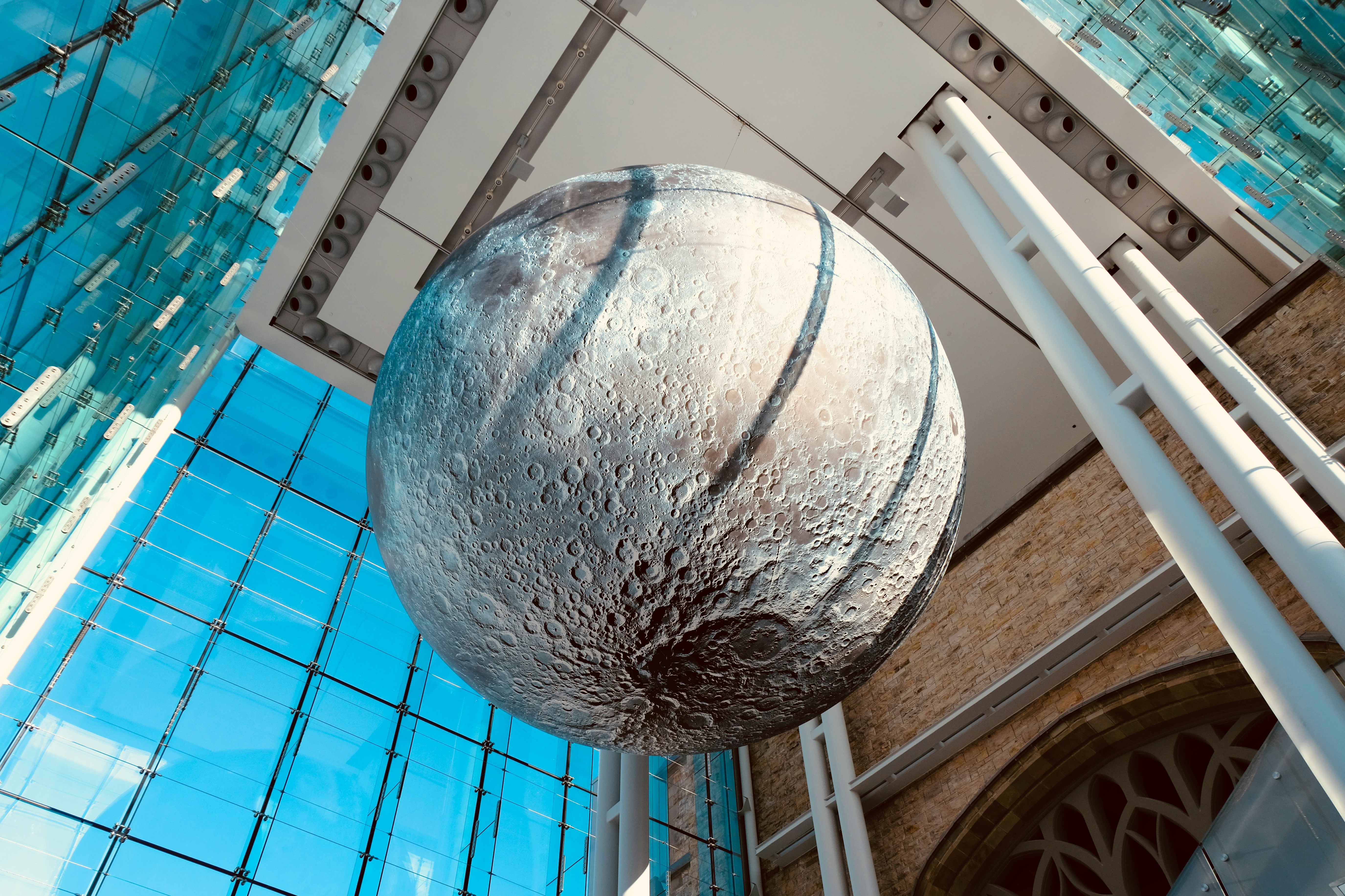Floating Moon over Modern Glass and Steel
