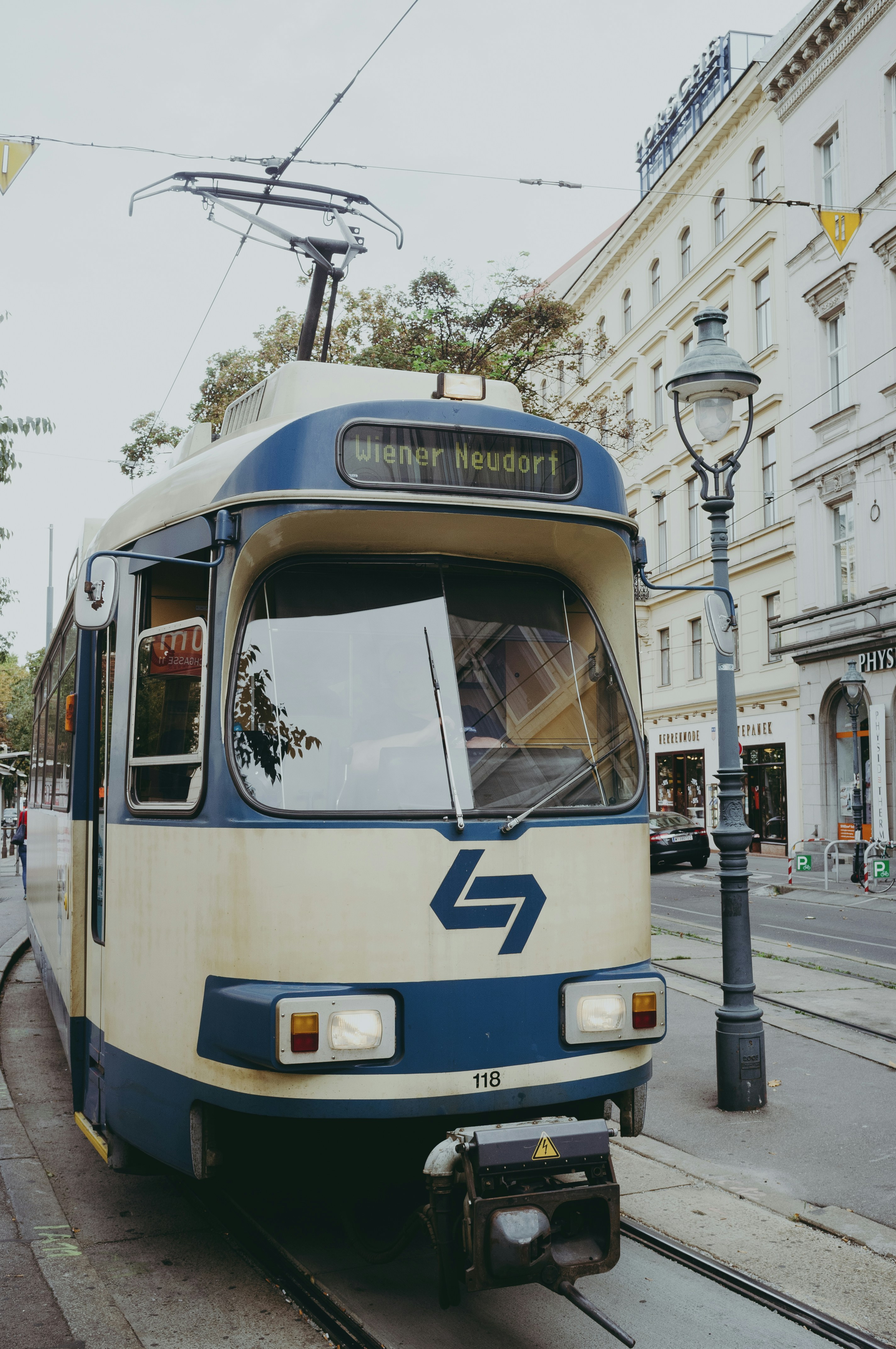Blue-Cream Viennese Streetcar on a Quiet City Street
