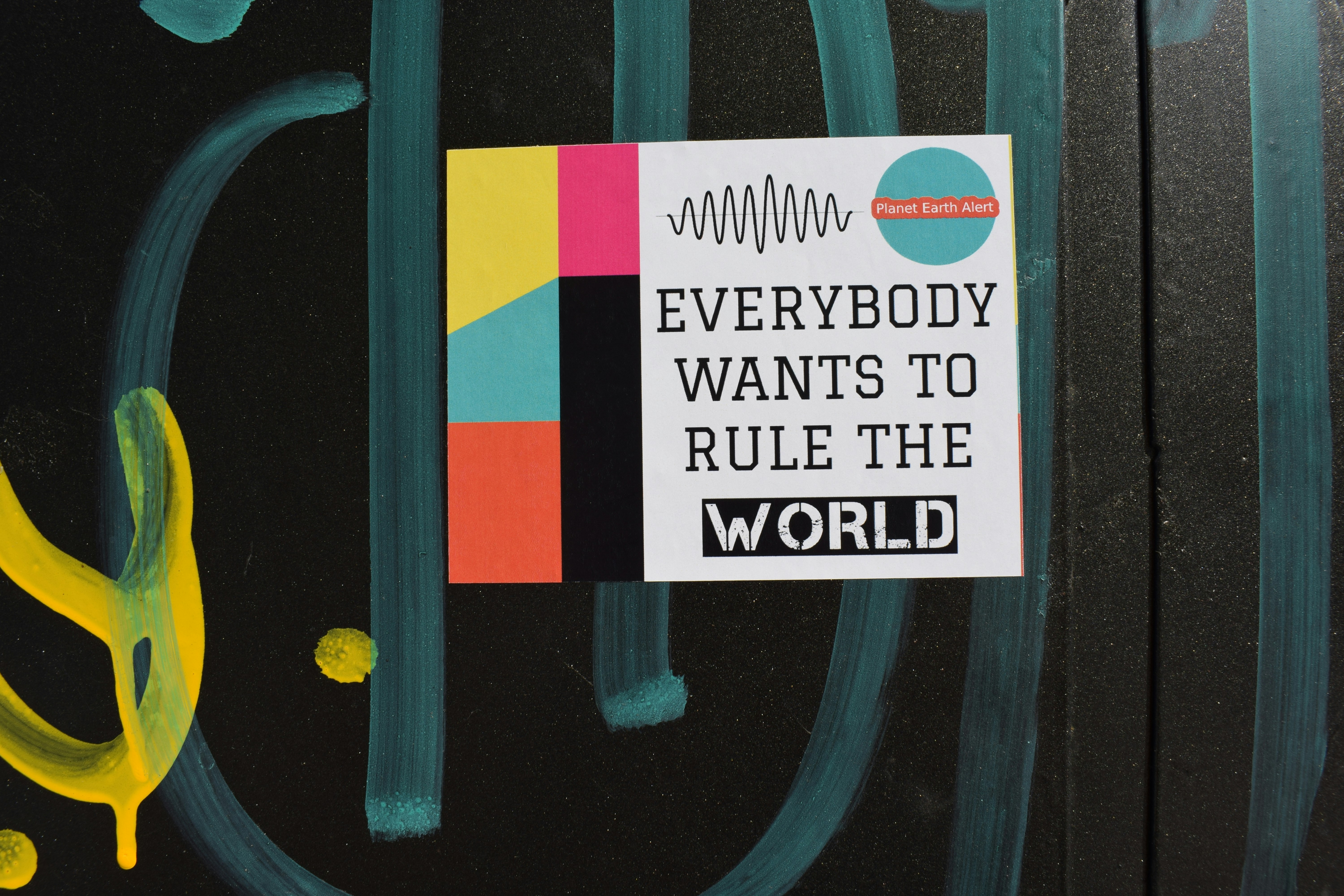 A close up of a sticker on a wall photo – Free Text Image on Unsplash