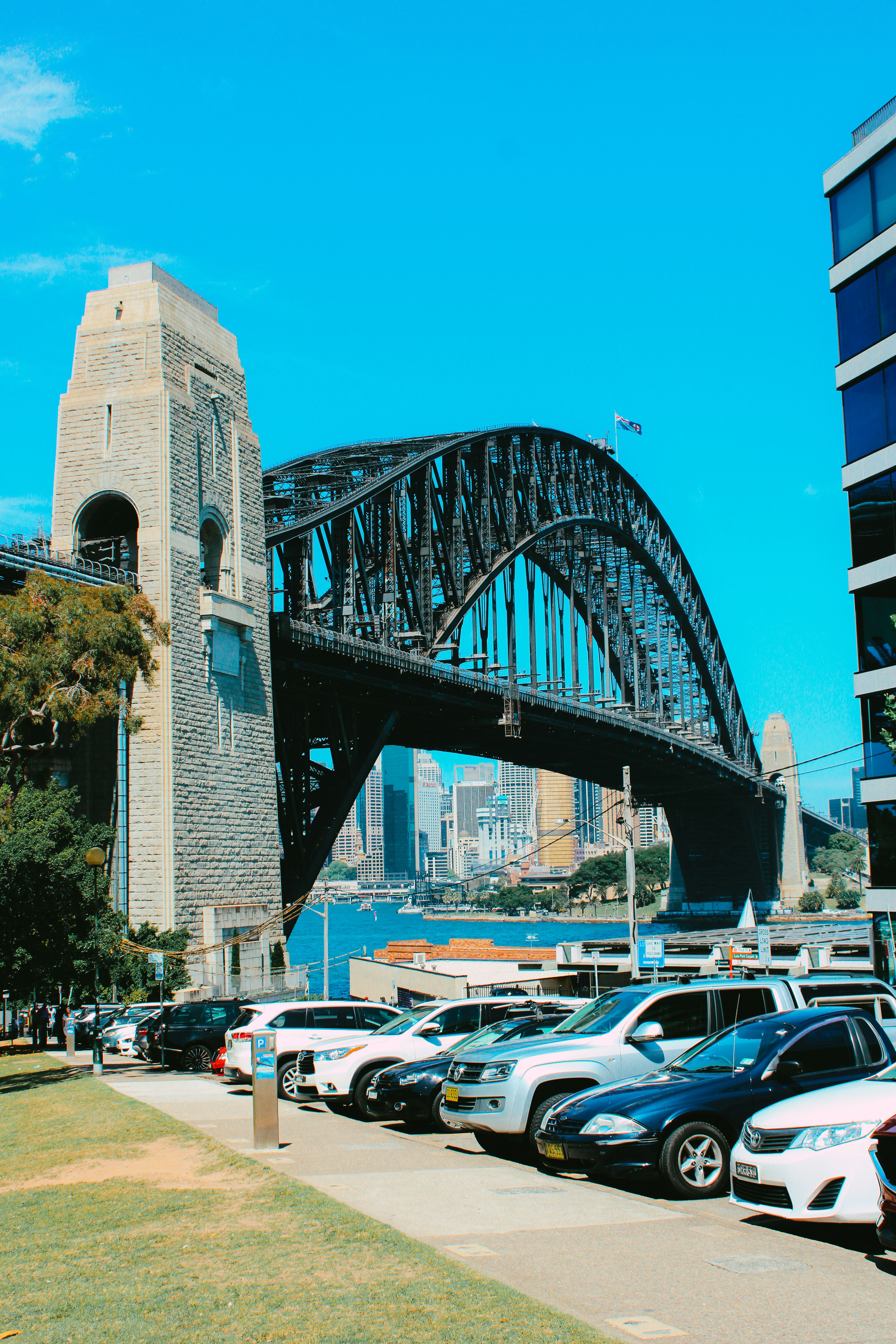 cars parked on side of the bridge during night time