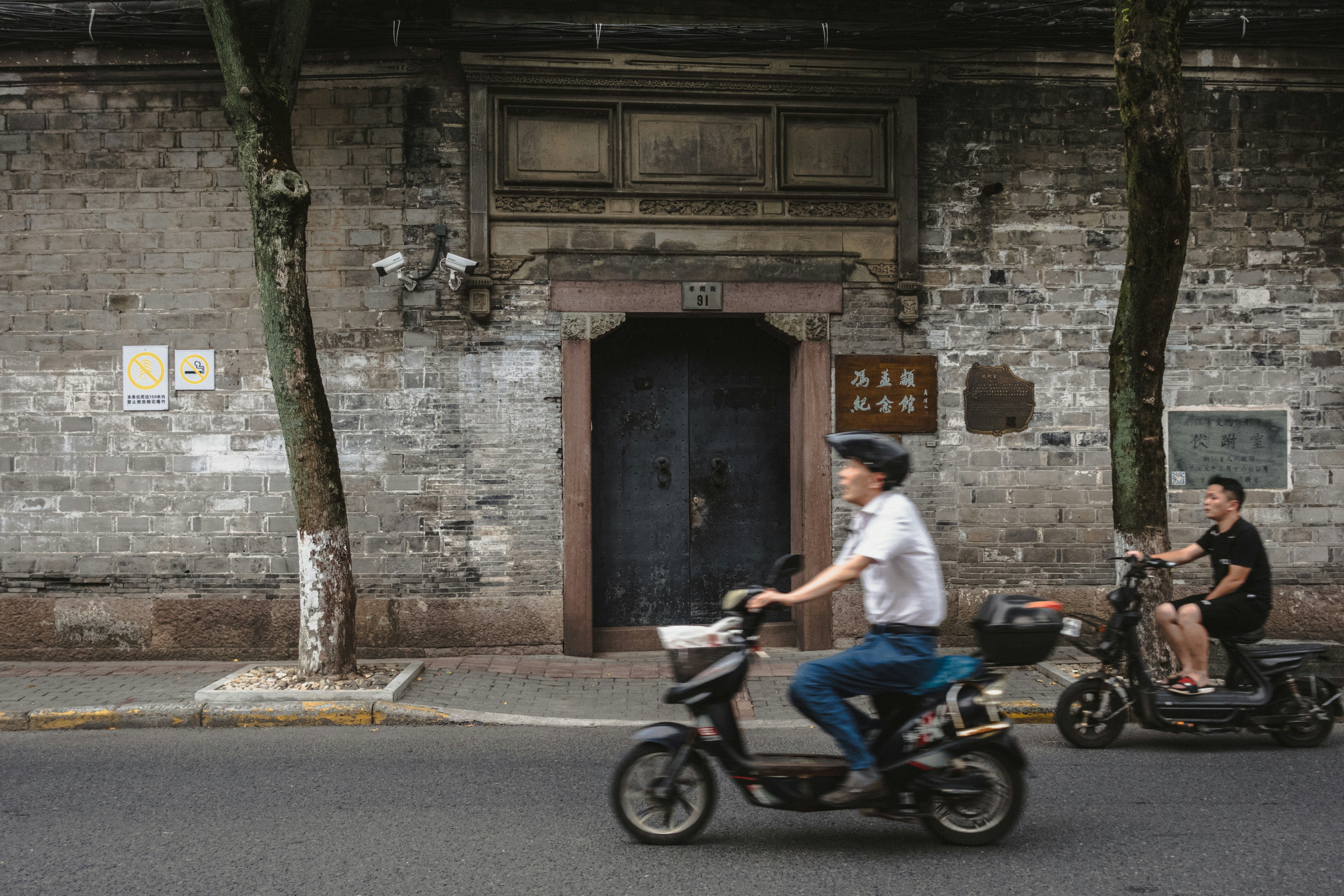 Man in blue shirt riding blue motorcycle on road during daytime photo ...