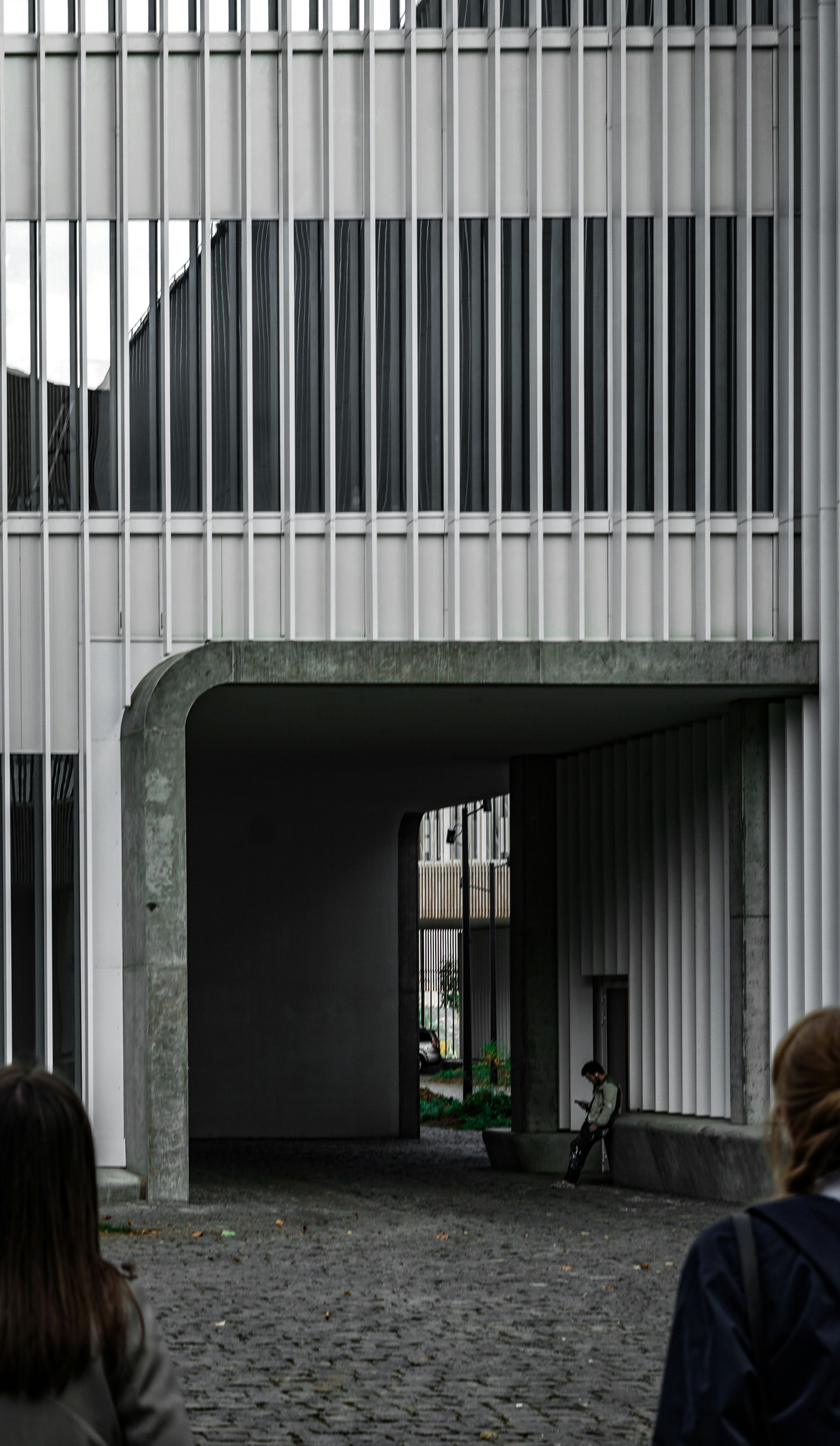 Gridded Facade Corridor: A Quiet Passage Through Concrete Arches