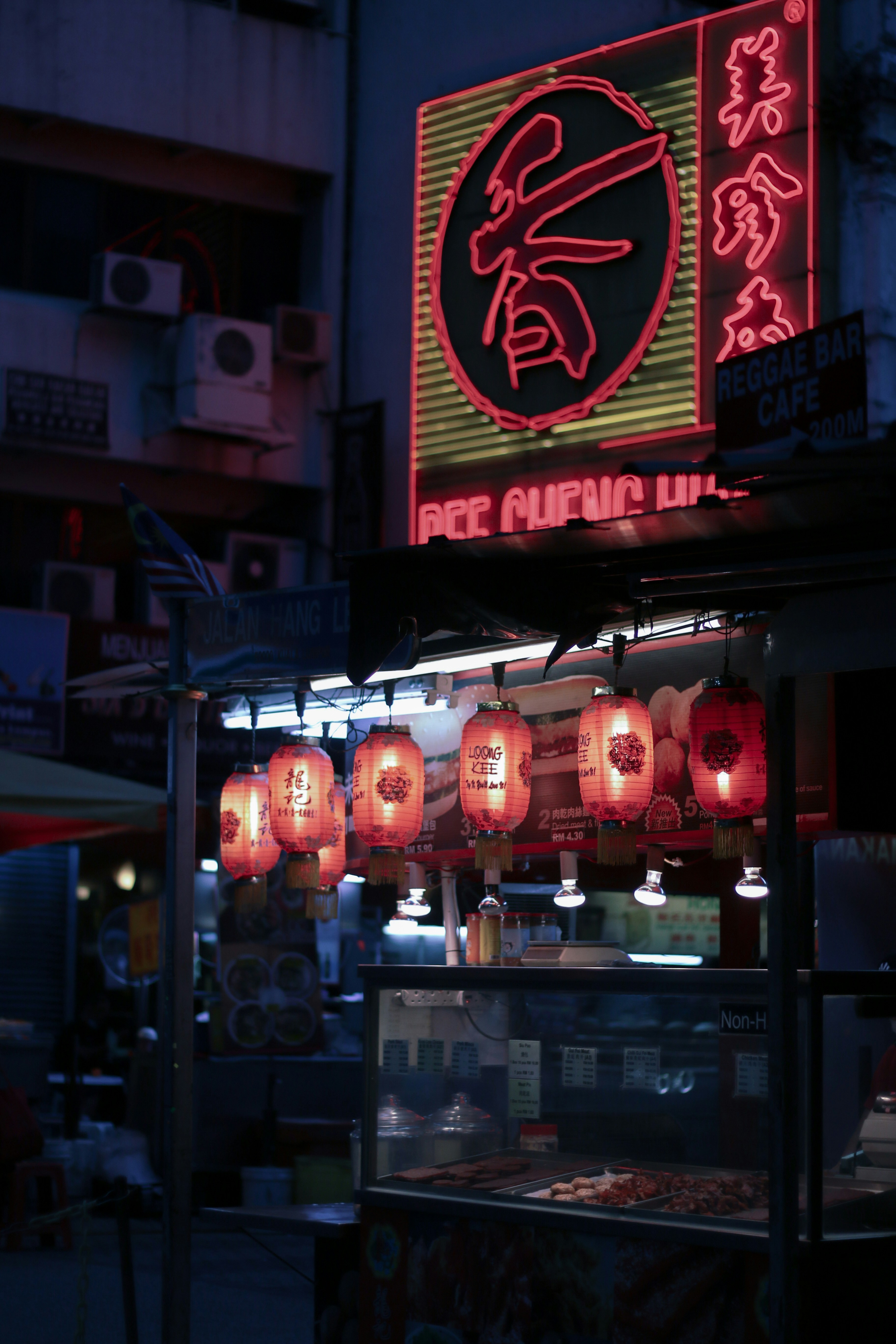Crimson Lanterns Under Neon Glow: Night Market Stall at Blue Hour